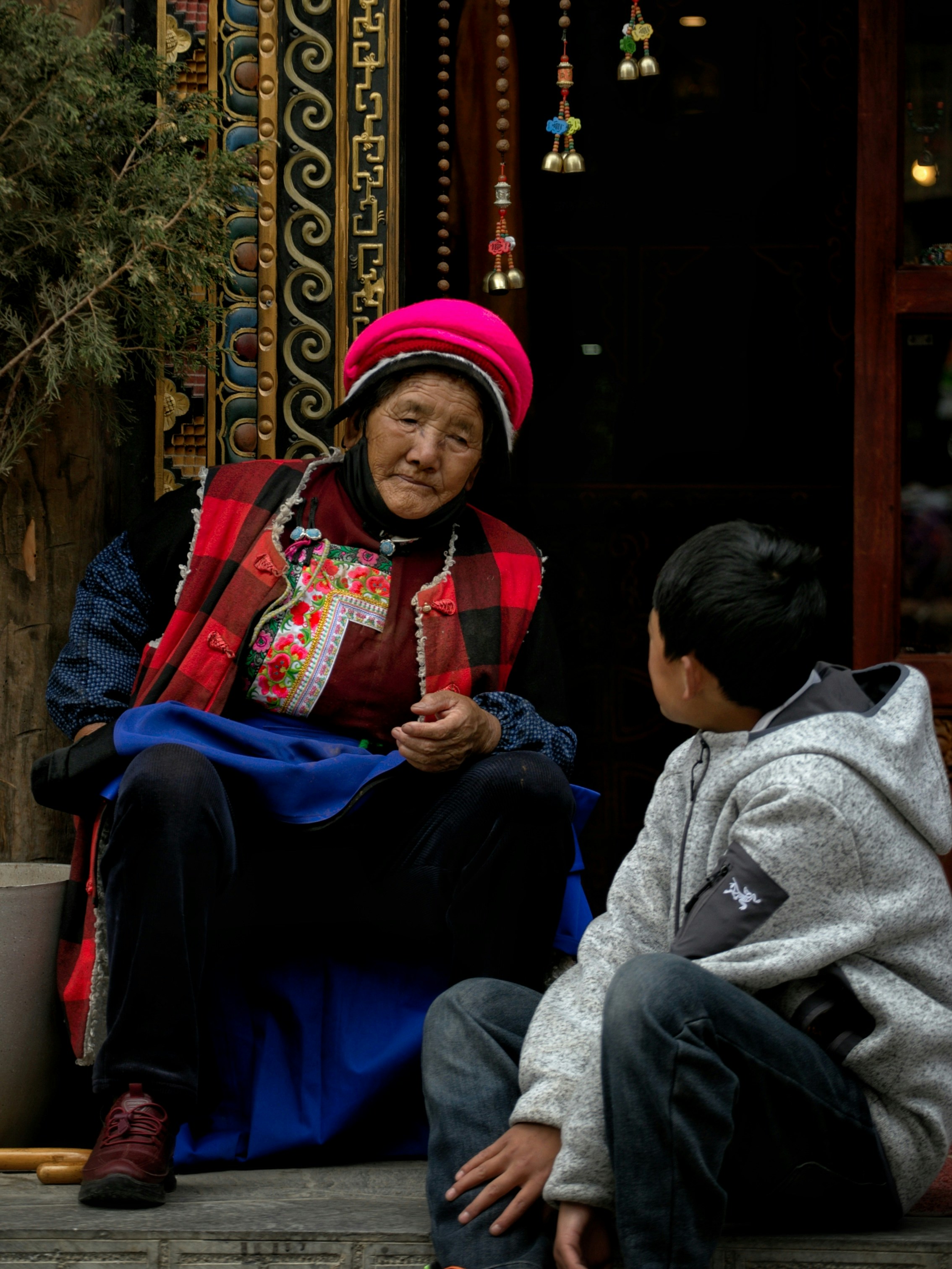 Intergenerational Moment on a Temple Threshold