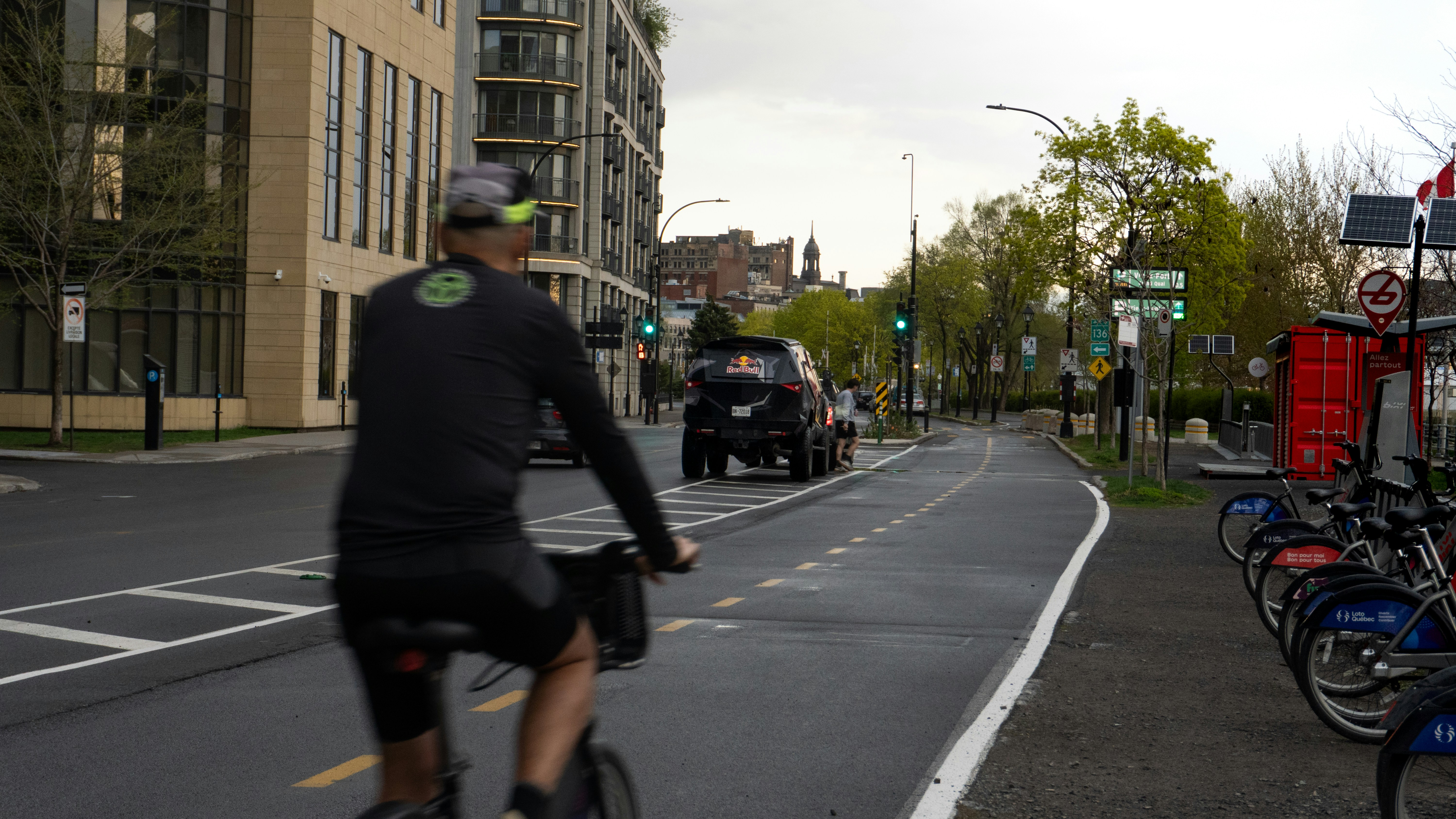 Blurred Cyclist and Street Scene on a City Avenue