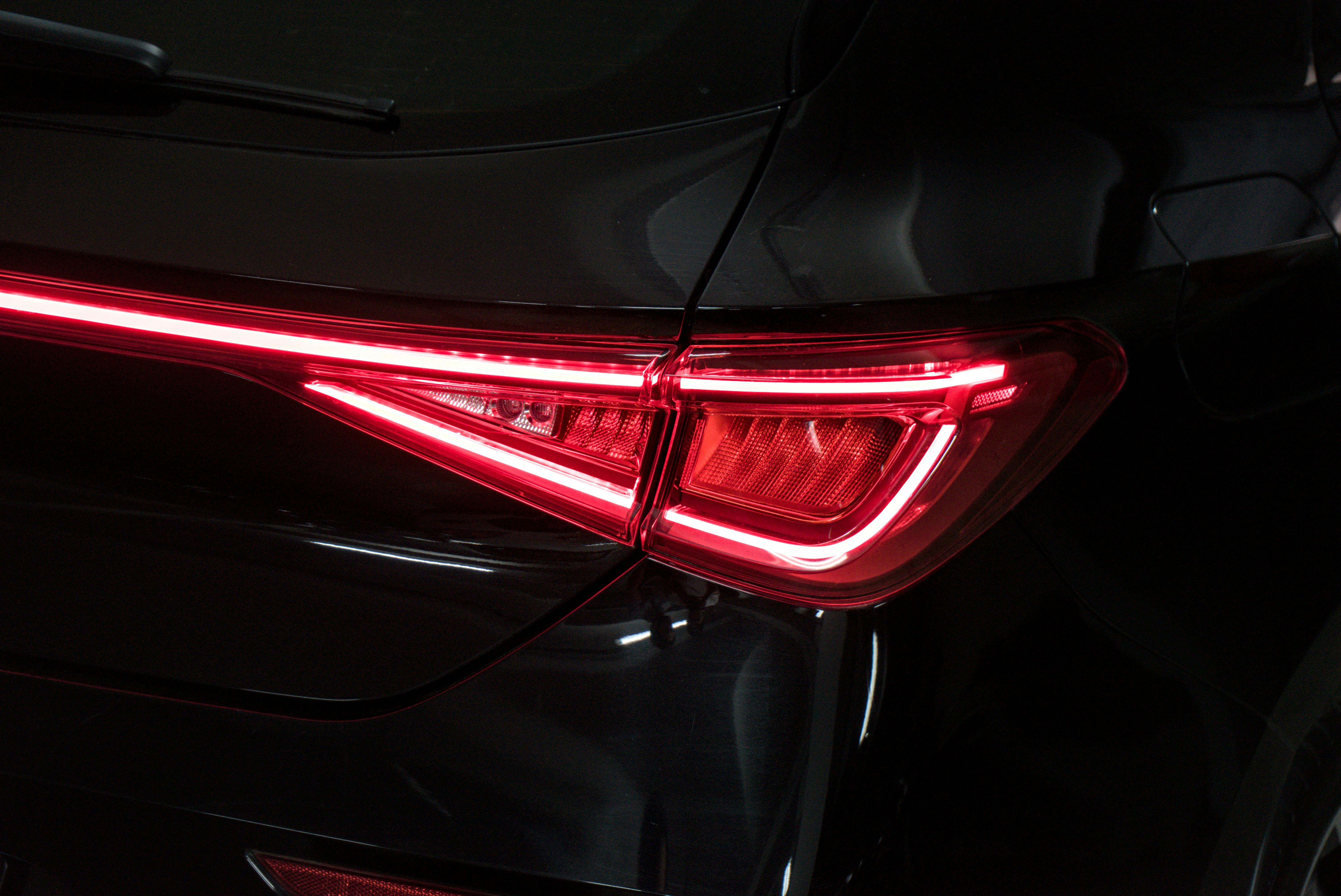 Neon Edge: Focused Glare of a Tail Light