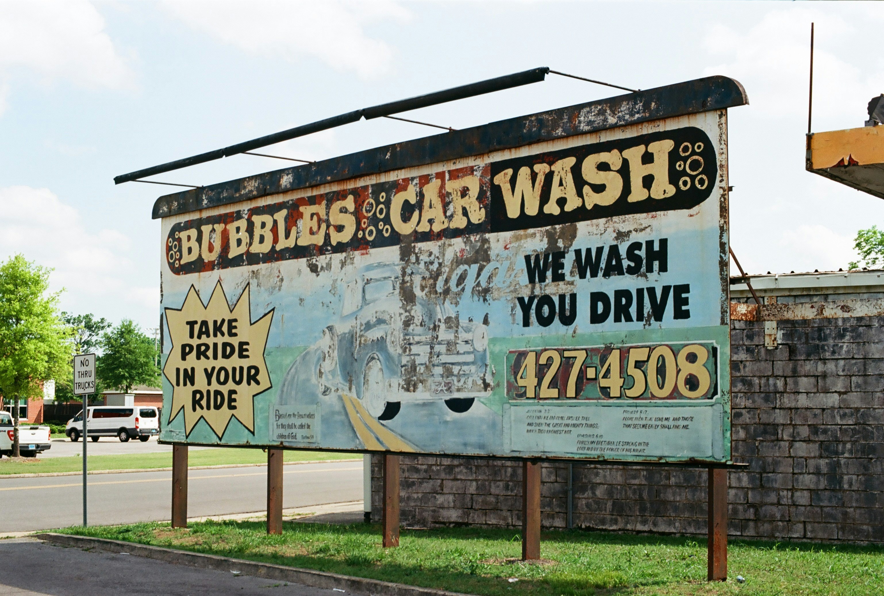 Retro Car Wash Billboard Worn by Time