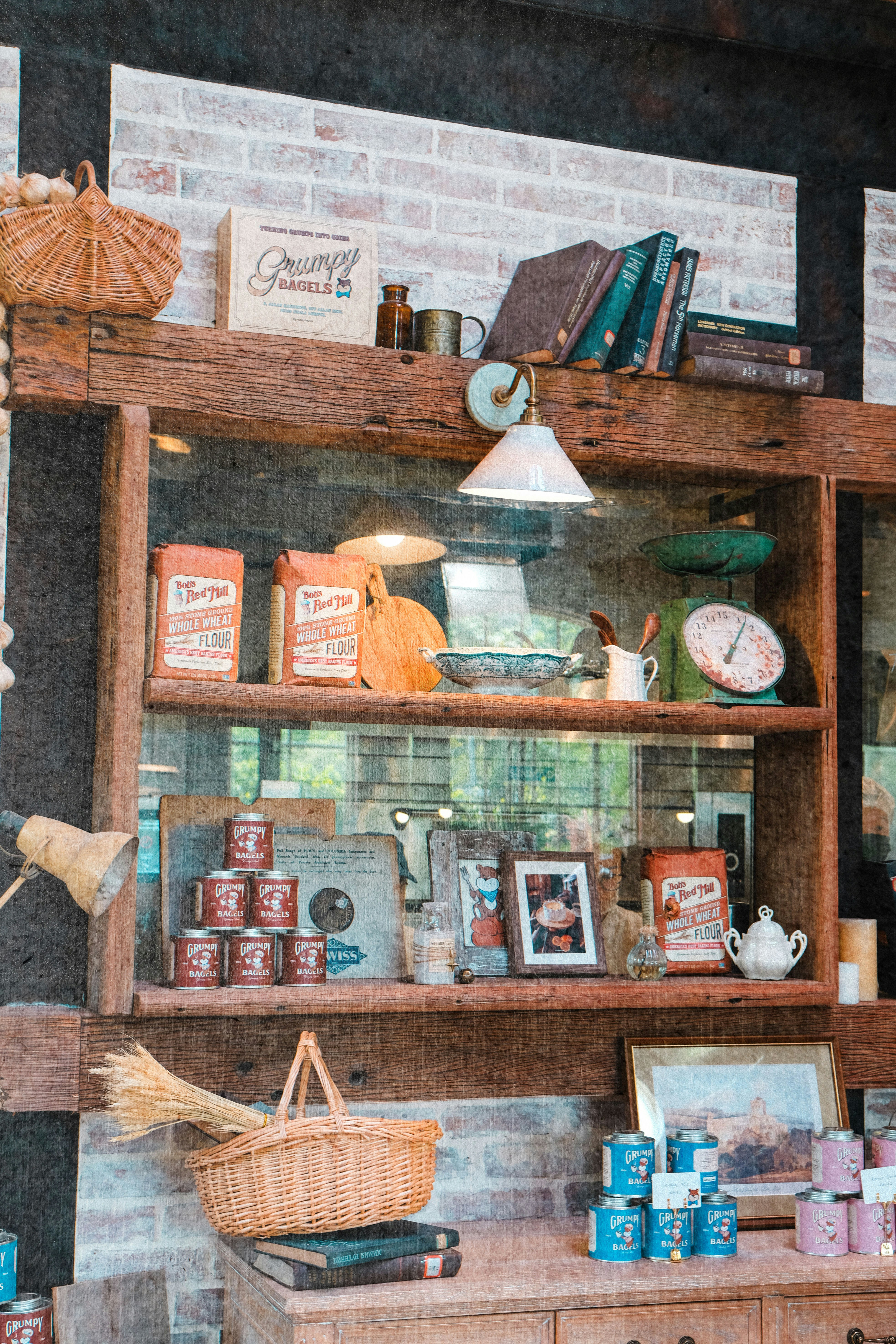 Rustic wooden shelves display vintage kitchen items and old books ...