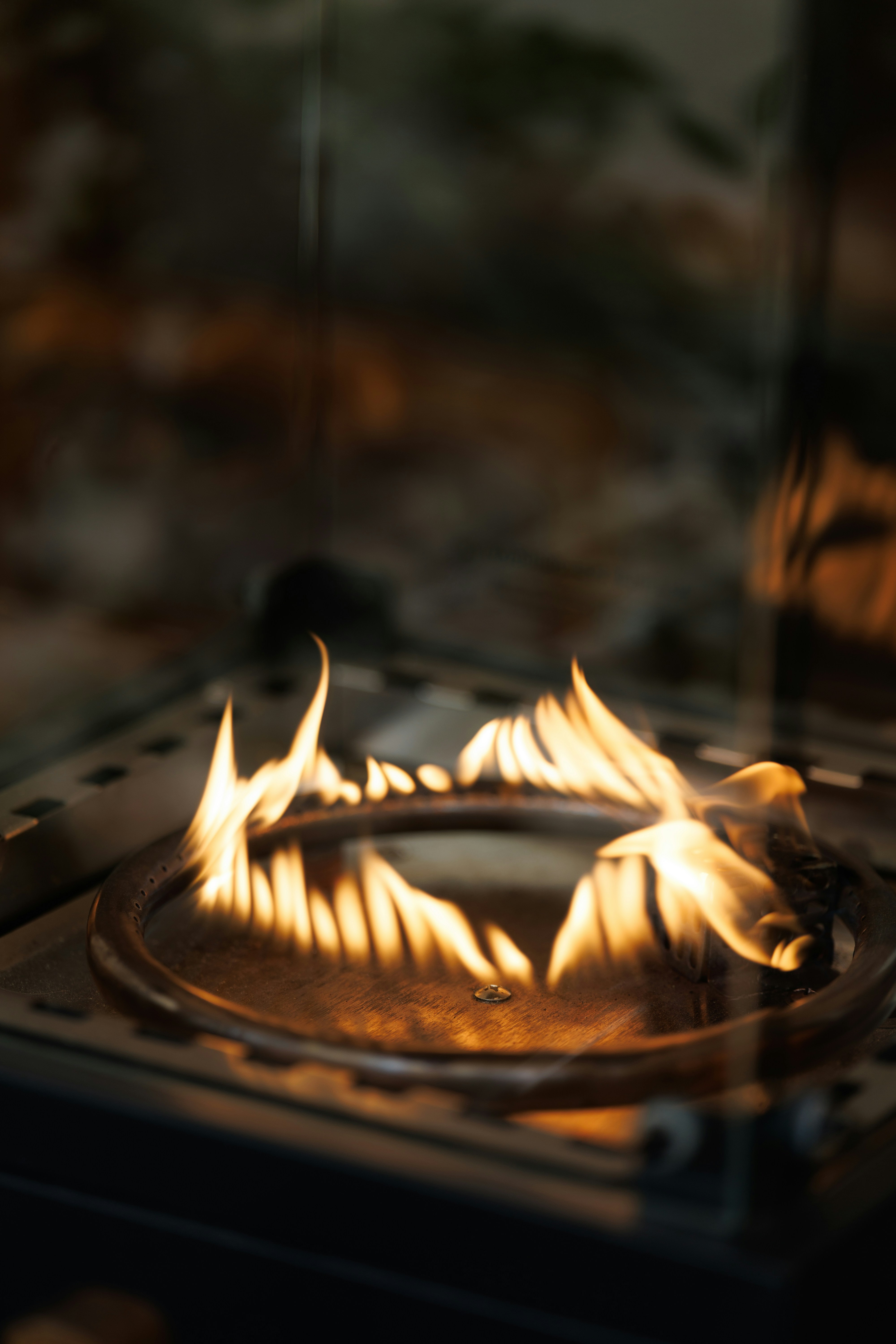 Flames in a Glass Ember: A Close-Up of Fire Ring in a Modern Stove