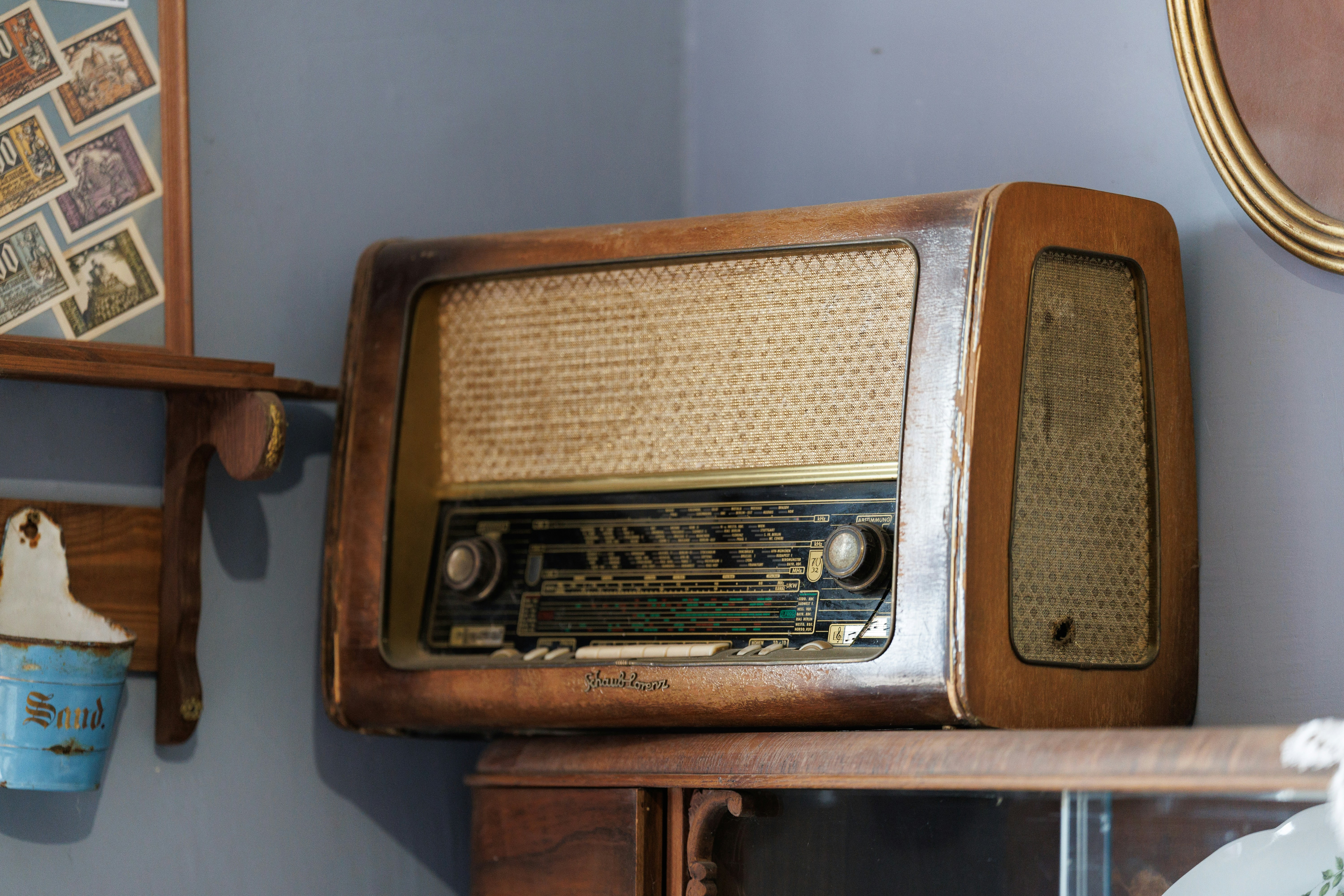 Retro Echo: A Vintage Radio Anchored on a Wooden Mantel