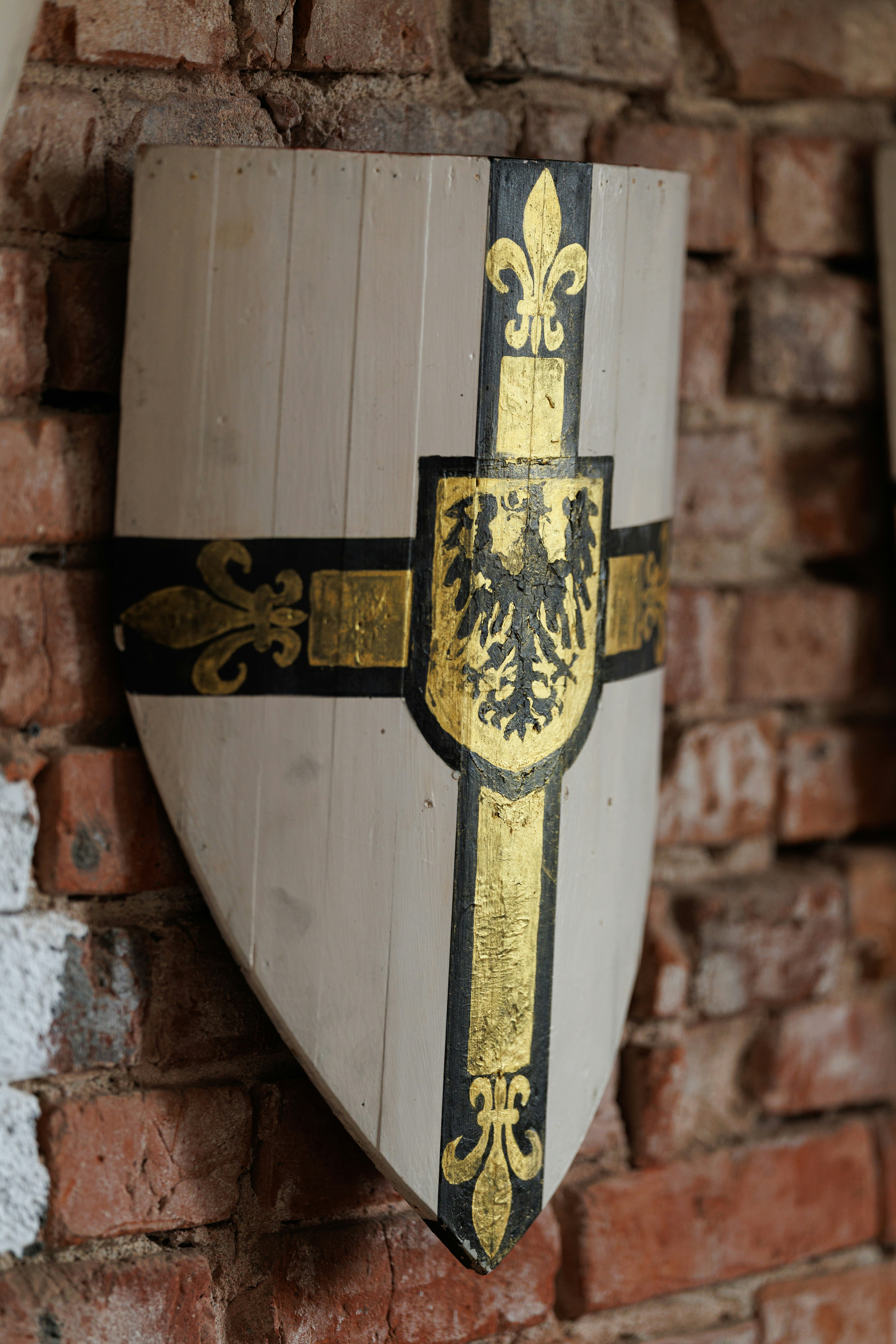 Heraldic Shield Adrift on Brick