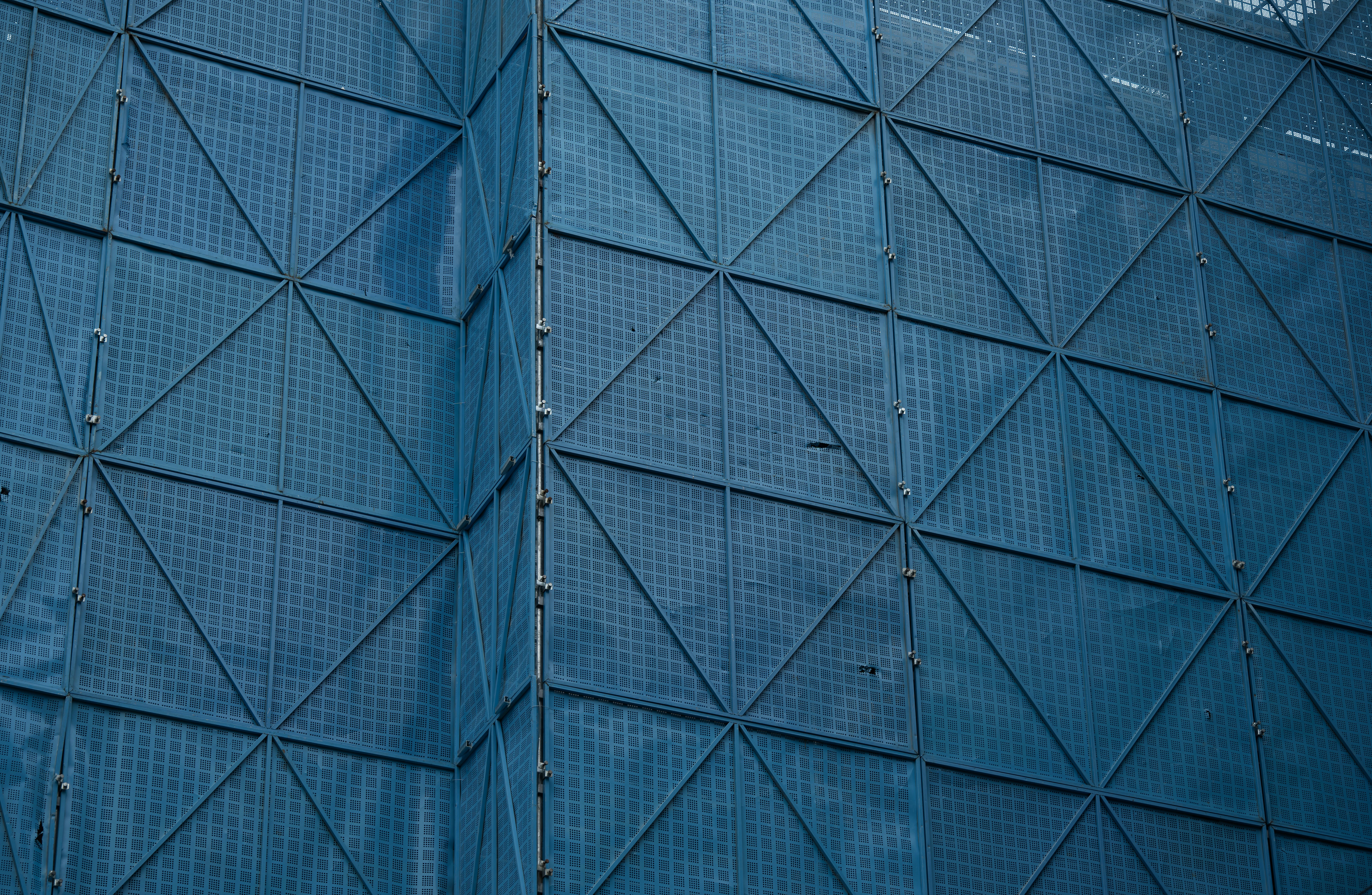 Blue Geometric Facade: A Tapestry of Steel and Light