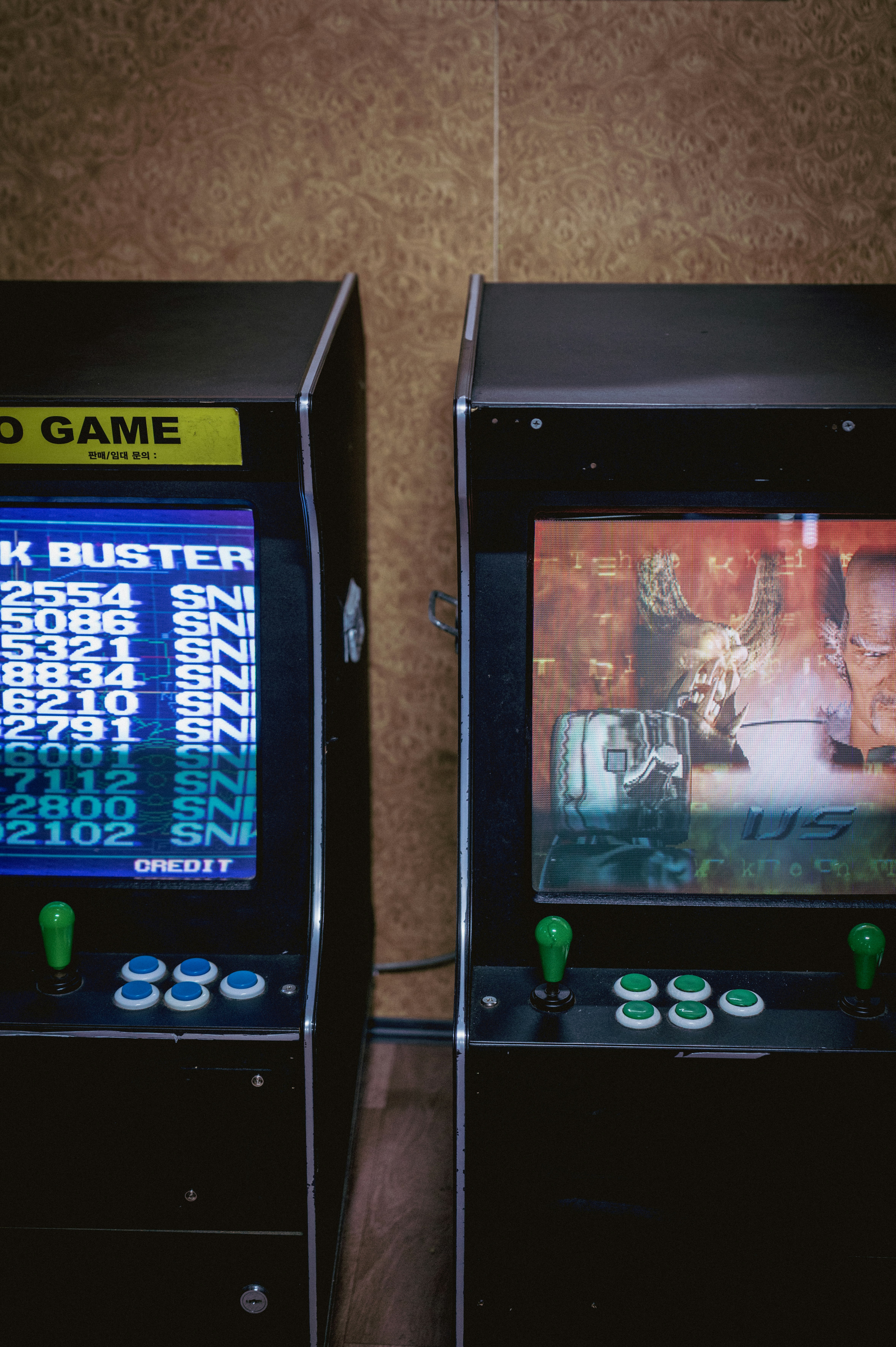 Retro arcade machines displaying game scores and graphics.