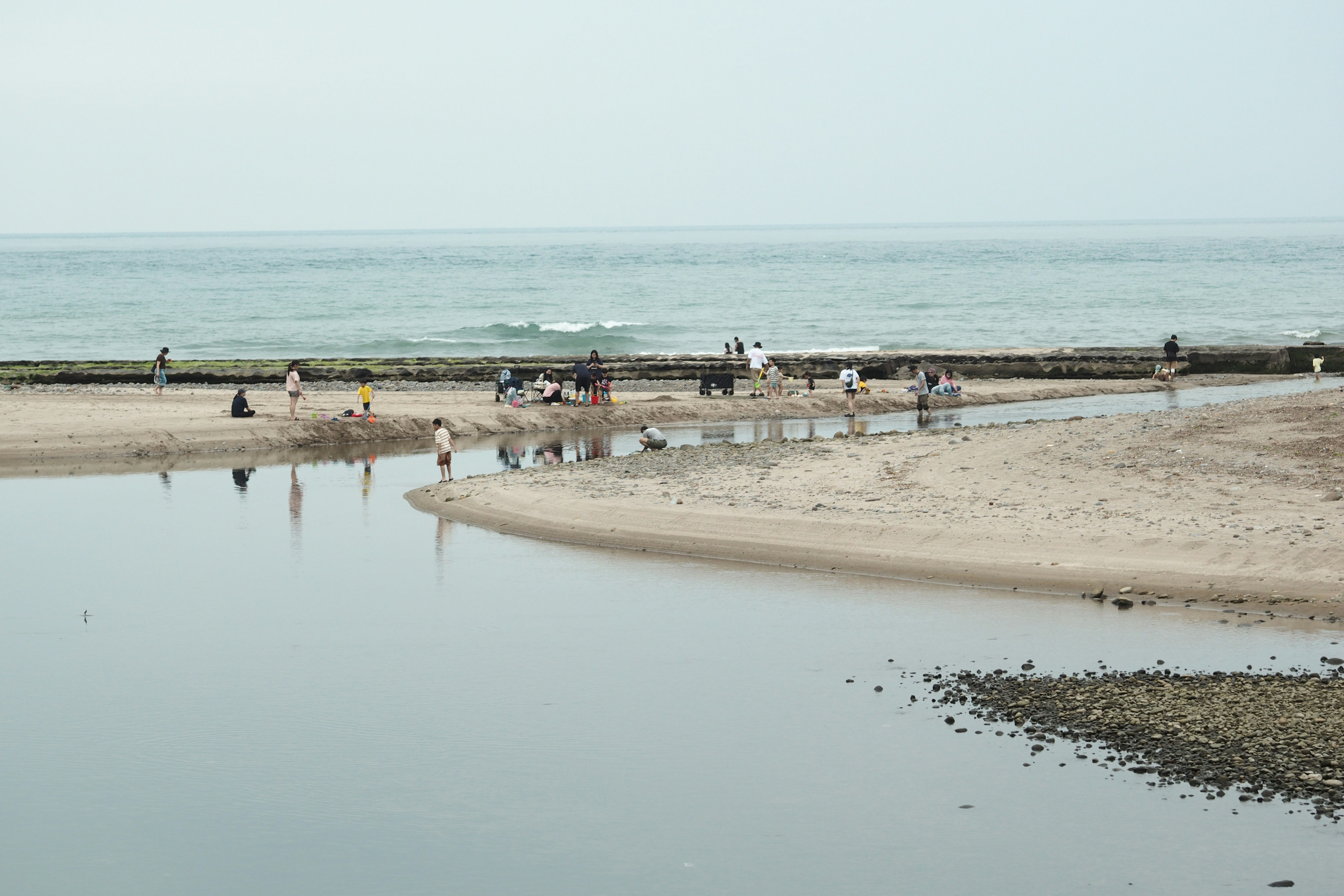 Coastal Confluence: Family and Tide at the Shore Break