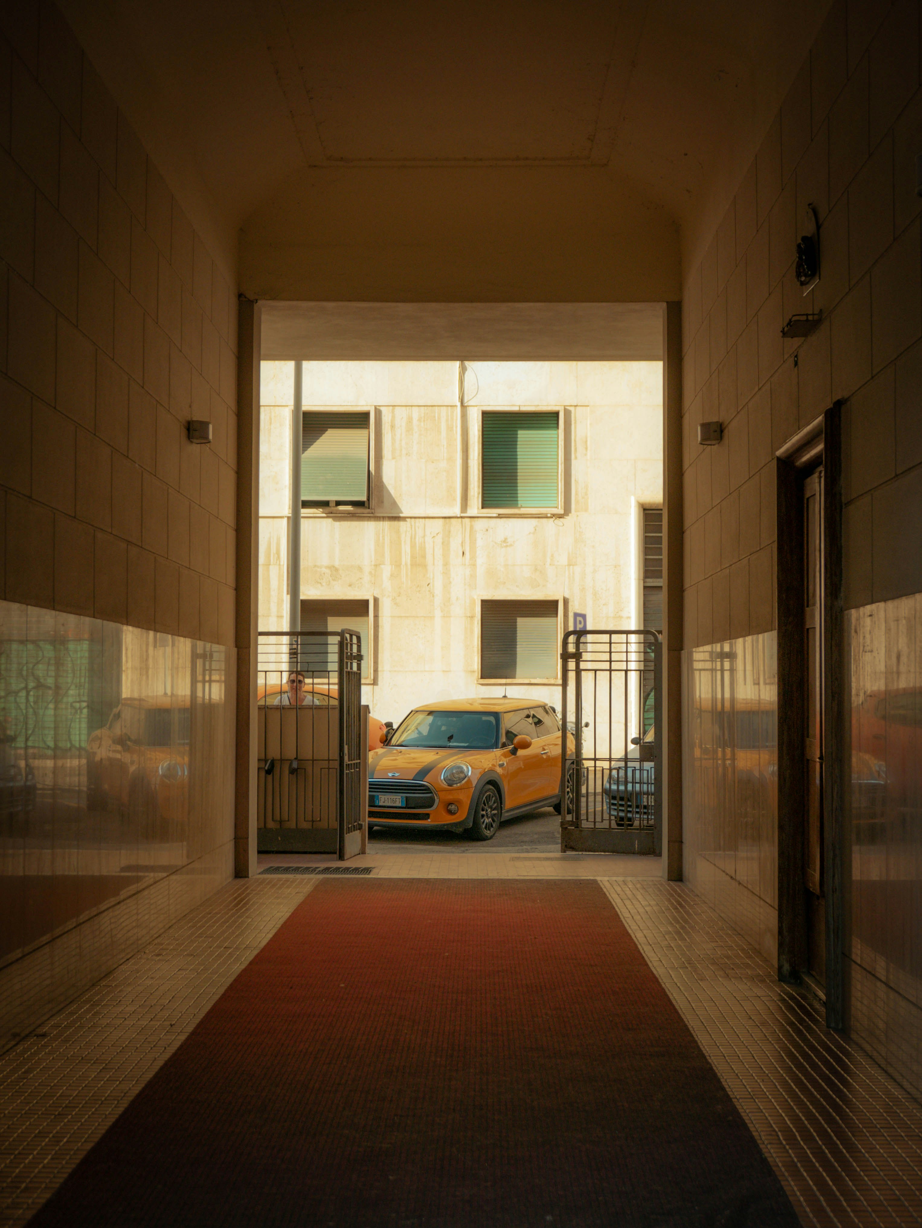 Golden Car in a Corridor: Light at the Gate