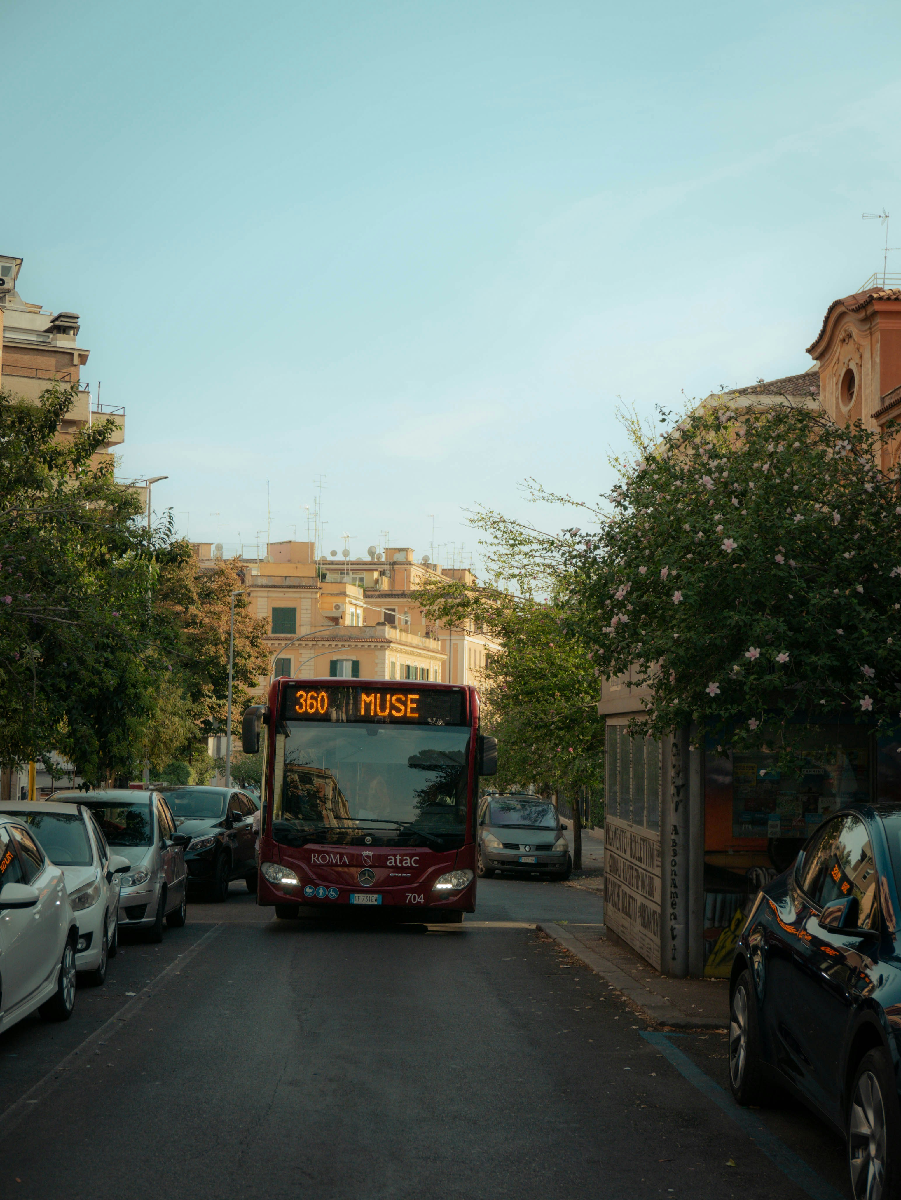 Evening Bus on a Sunlit Mediterranean Street