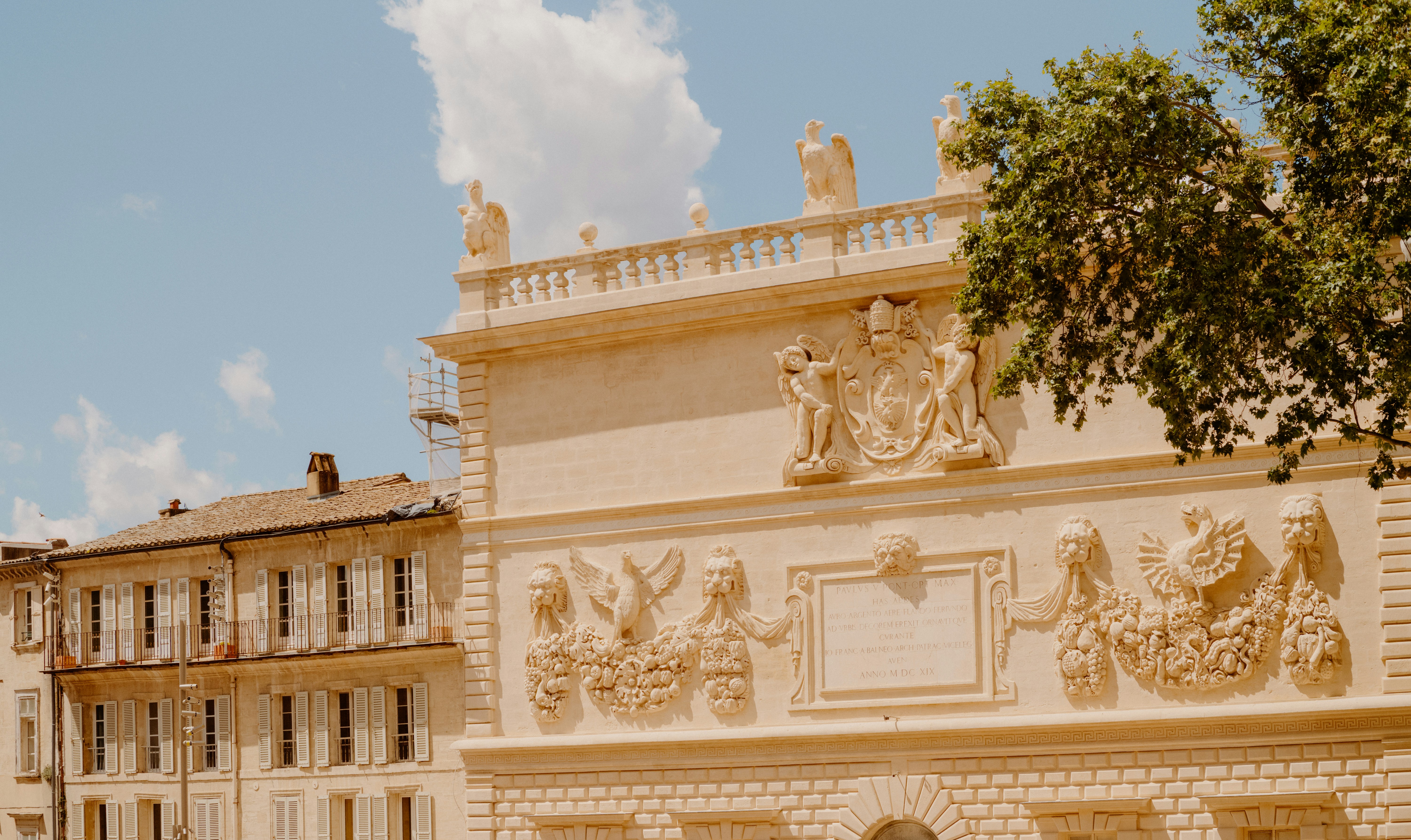 Sunlit Facade: Classical Reliefs and Amber Sky