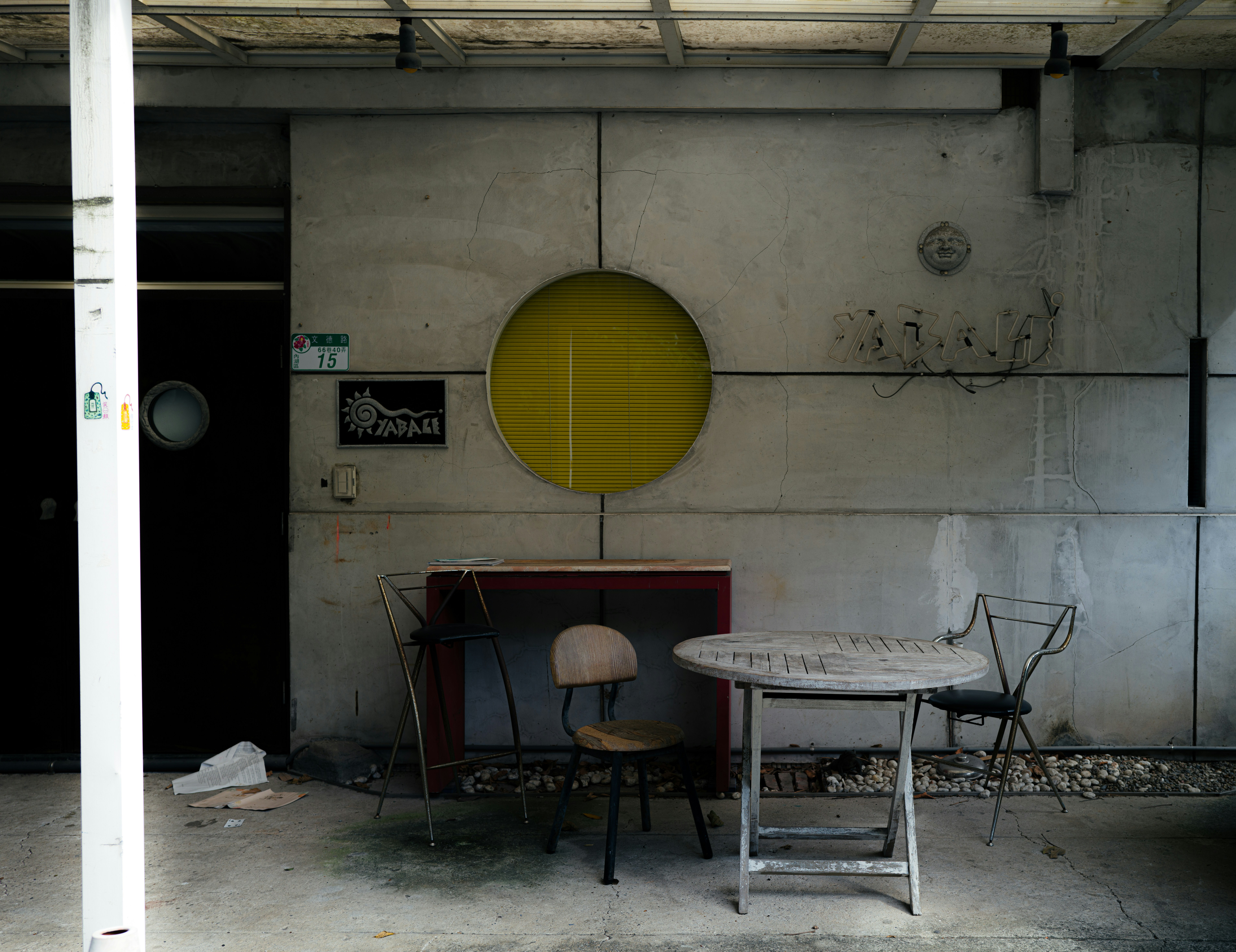 Abandoned Terrace: Yellow Circle Beacon and Weary Furnishings