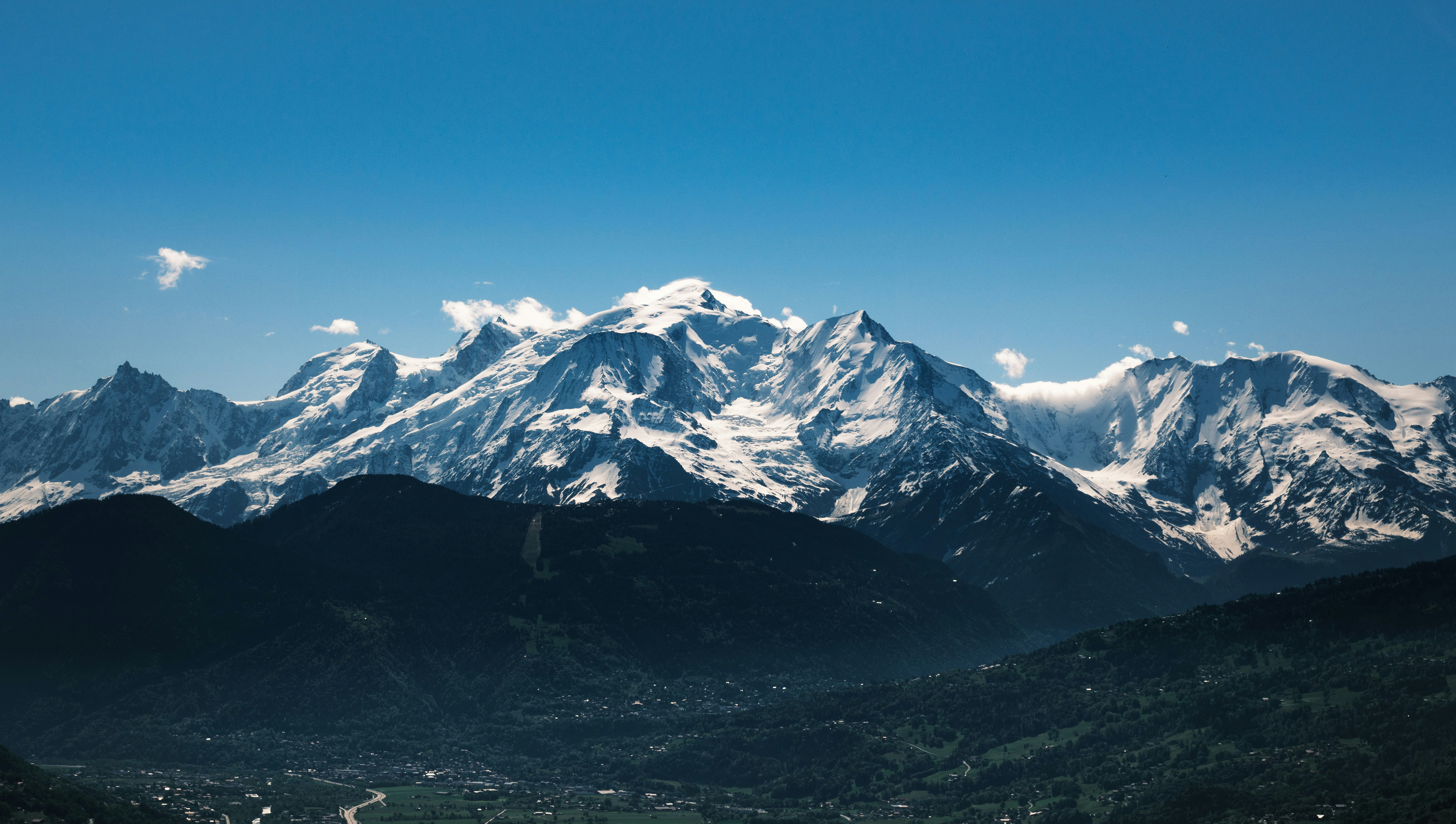 Snow-Crowned Peaks Over a Quiet Valley
