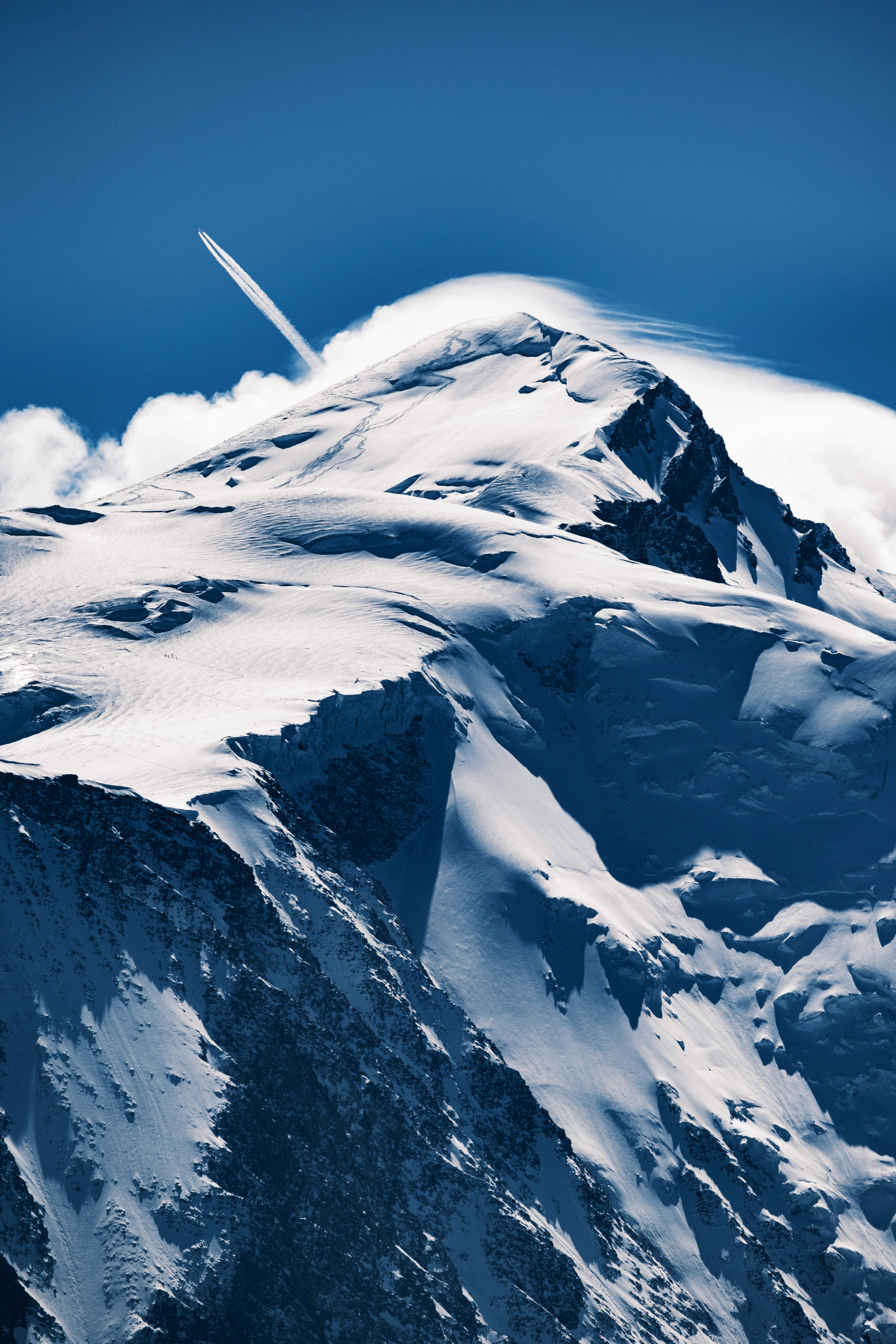Peak Crest under a Meteor-like Snow Cloud