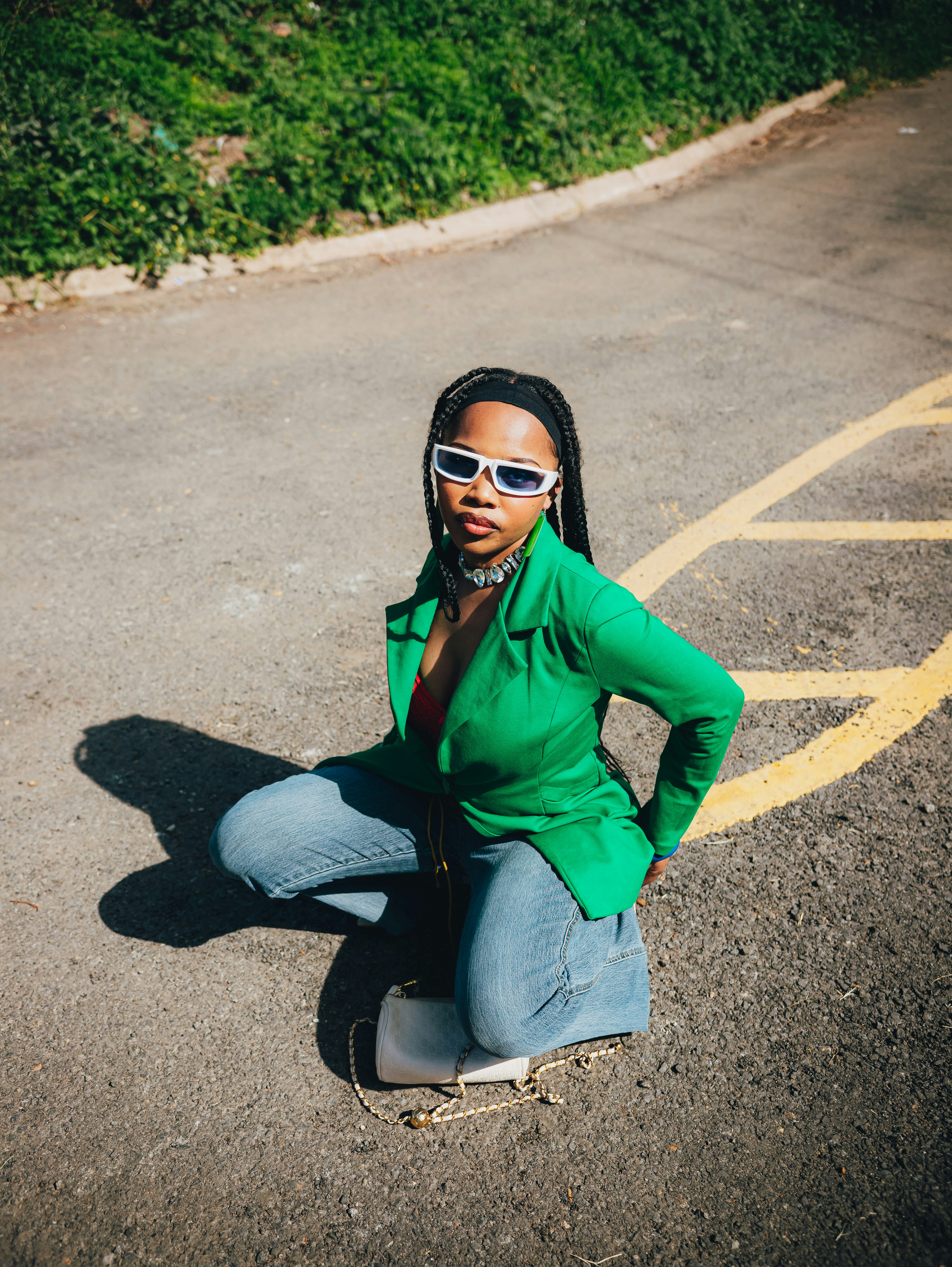 Emerald Blazer in a Parking Lot: A Bold Pose