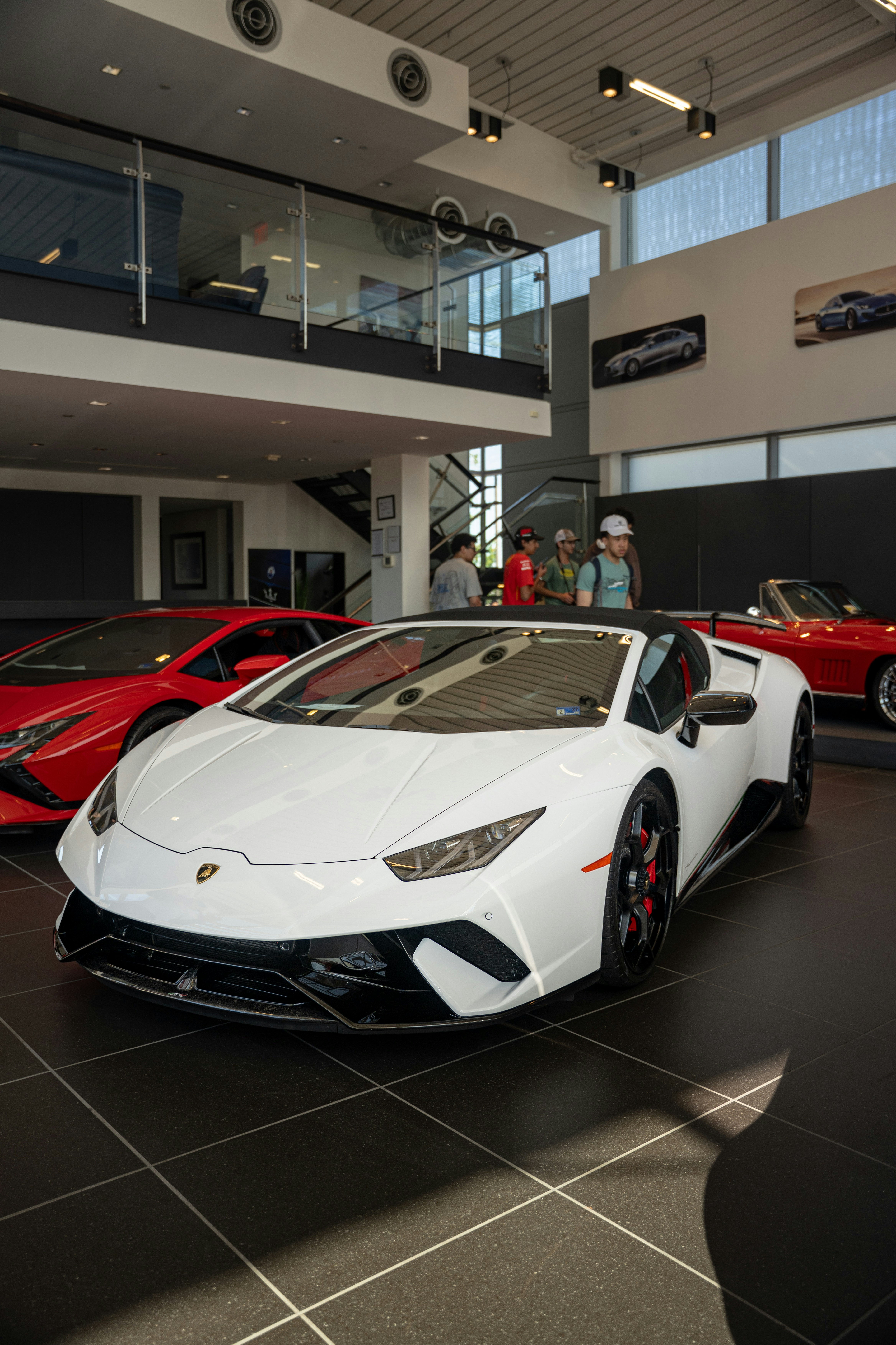 White Lamborghini Huracán in a Modern Car Showroom