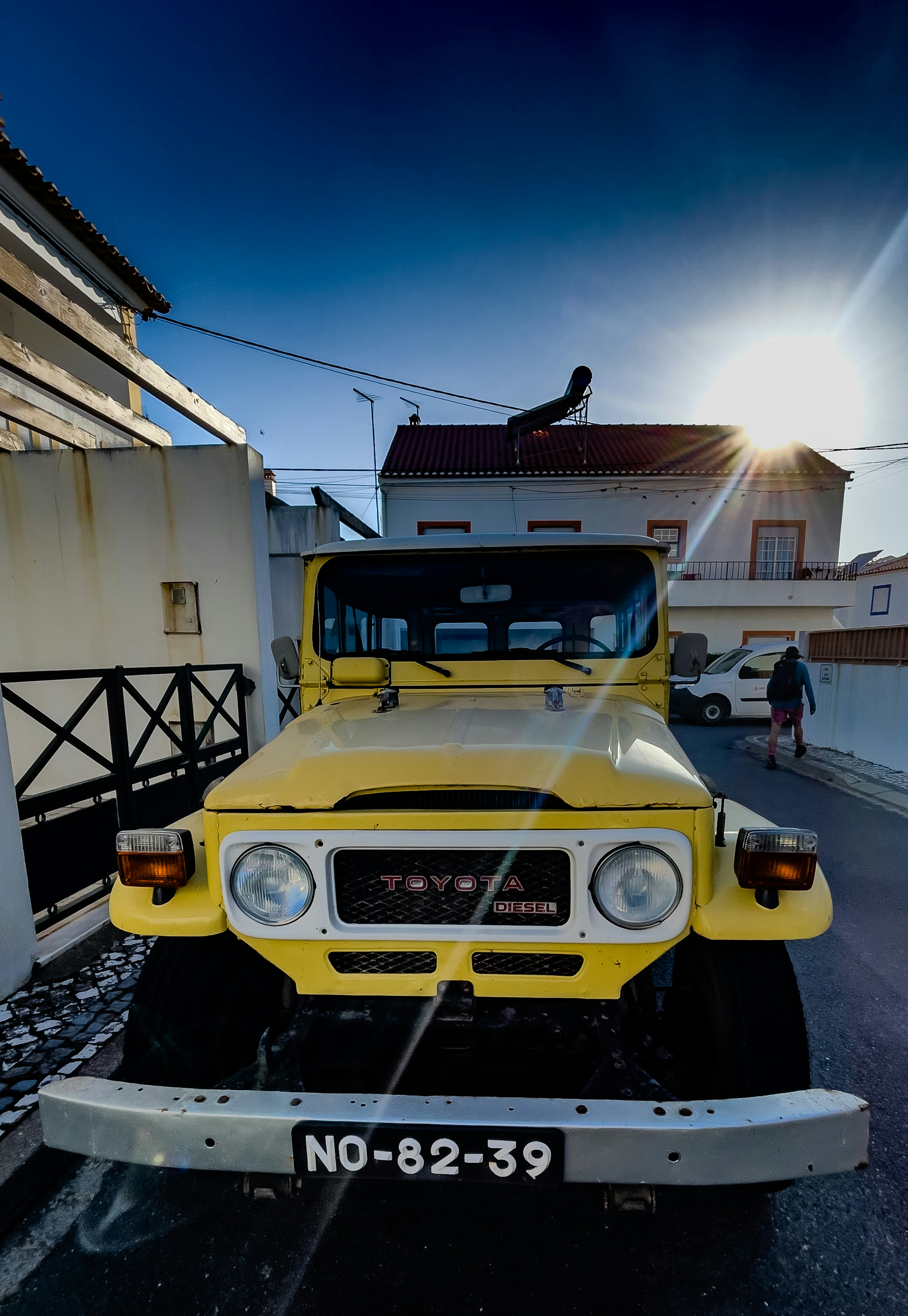 Yellow Beast on a Sunlit Street
