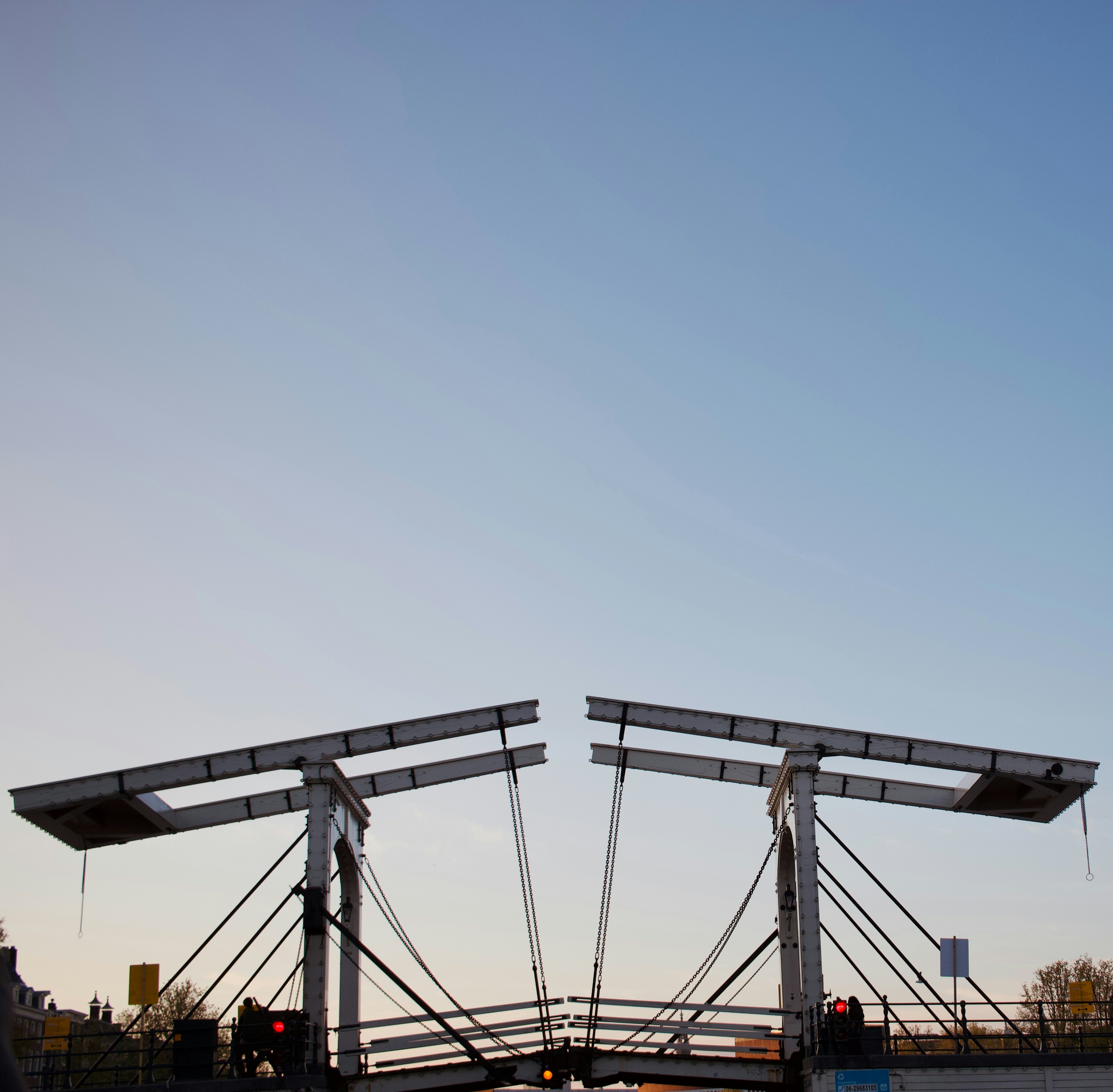 Rising Rails: A City Skyline Framing the Crossing Trestle