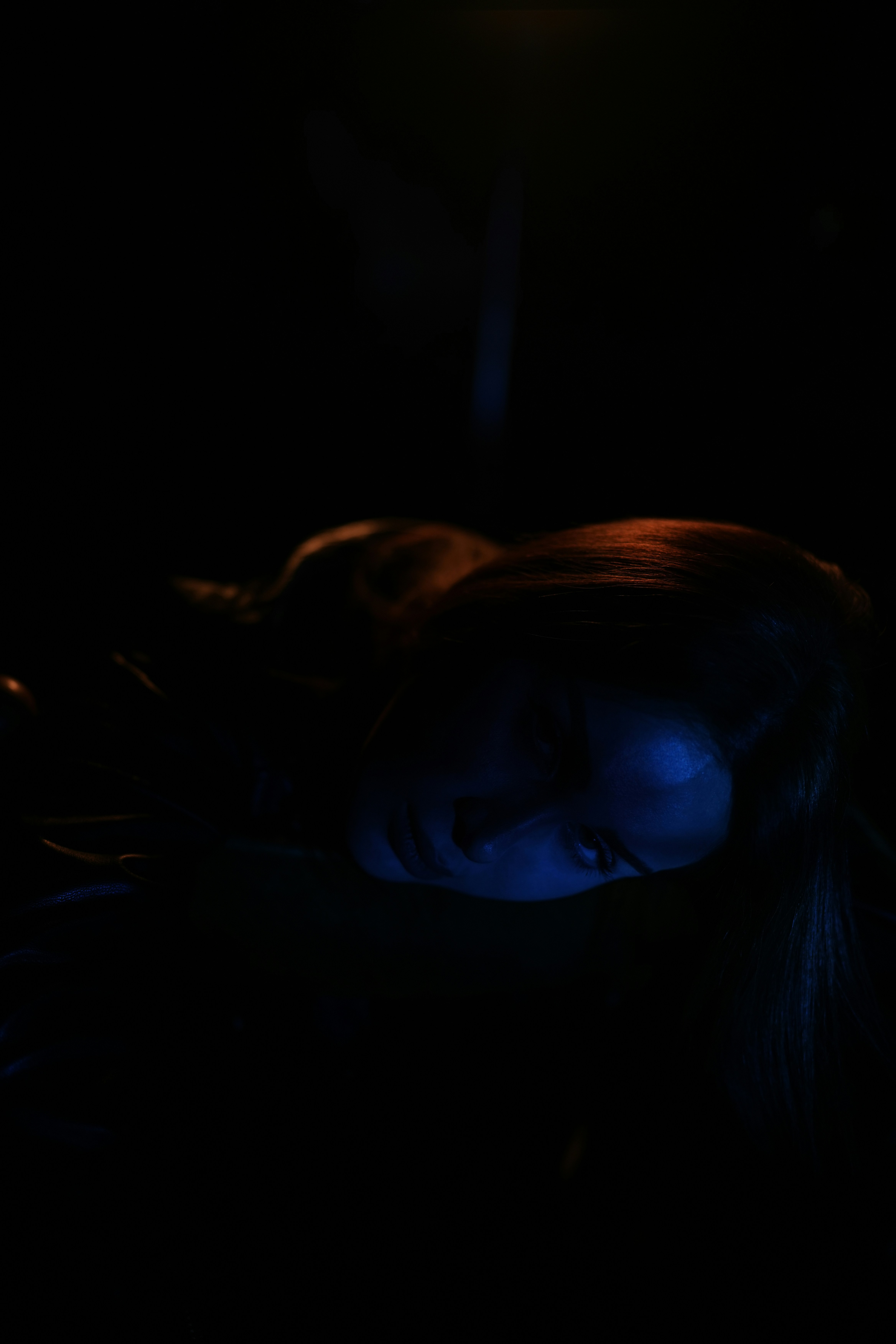 Blue-tinged Quiet: A Submerged Portrait in Low Light