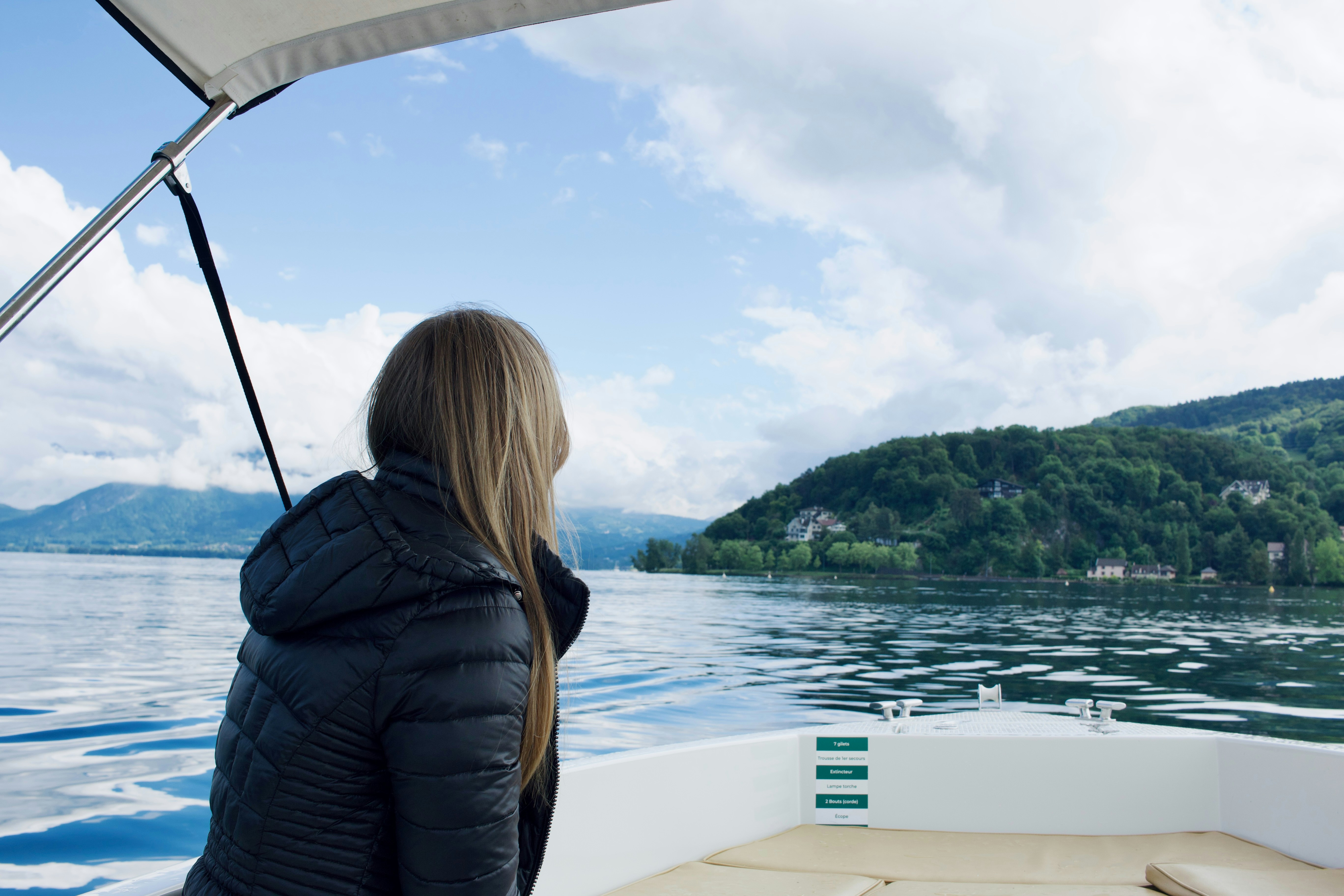 Voyager on the Lake: A Portrait at Dusk on a Calm Boat