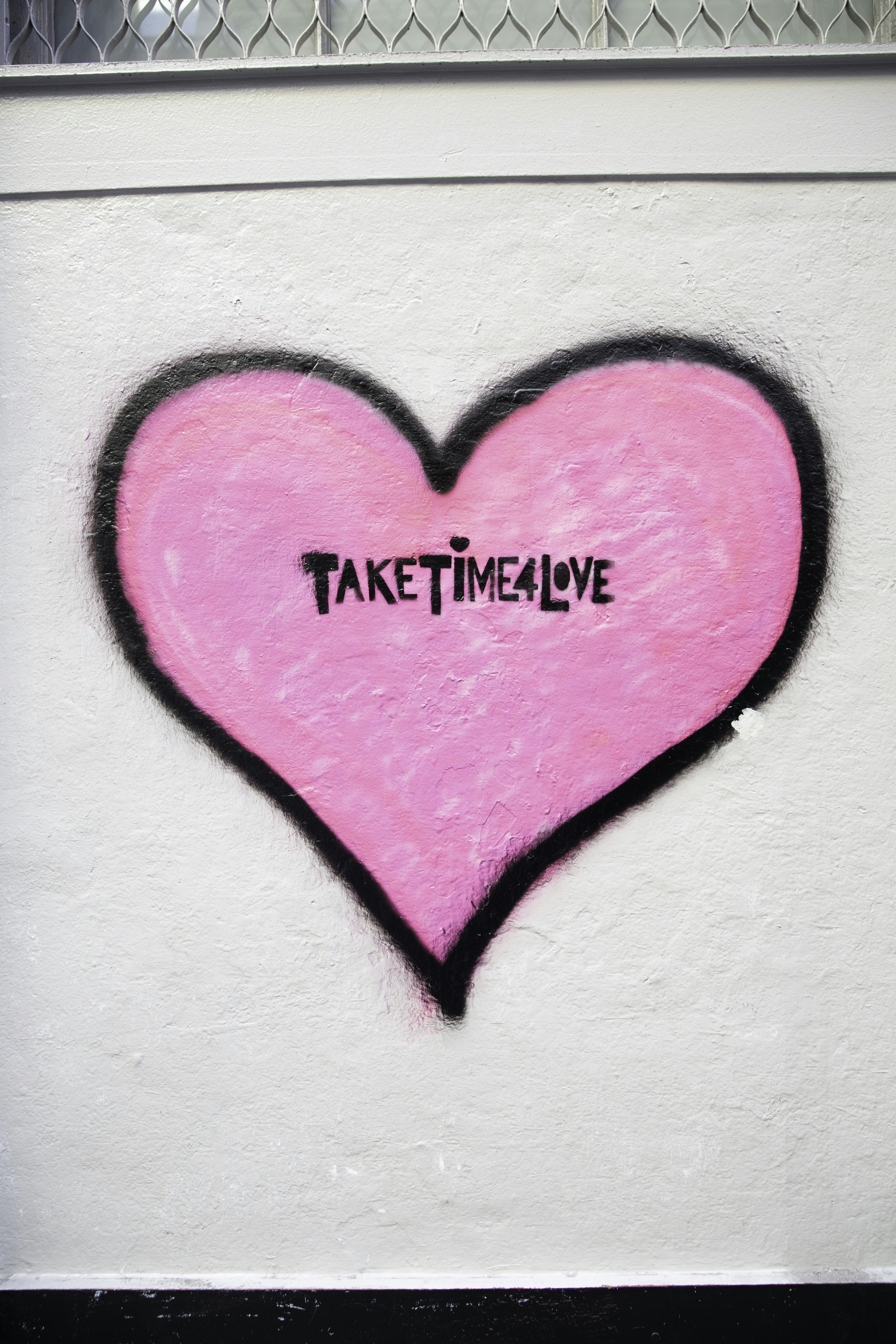 Pink Heart Graffiti: Time for Love on a Concrete Wall