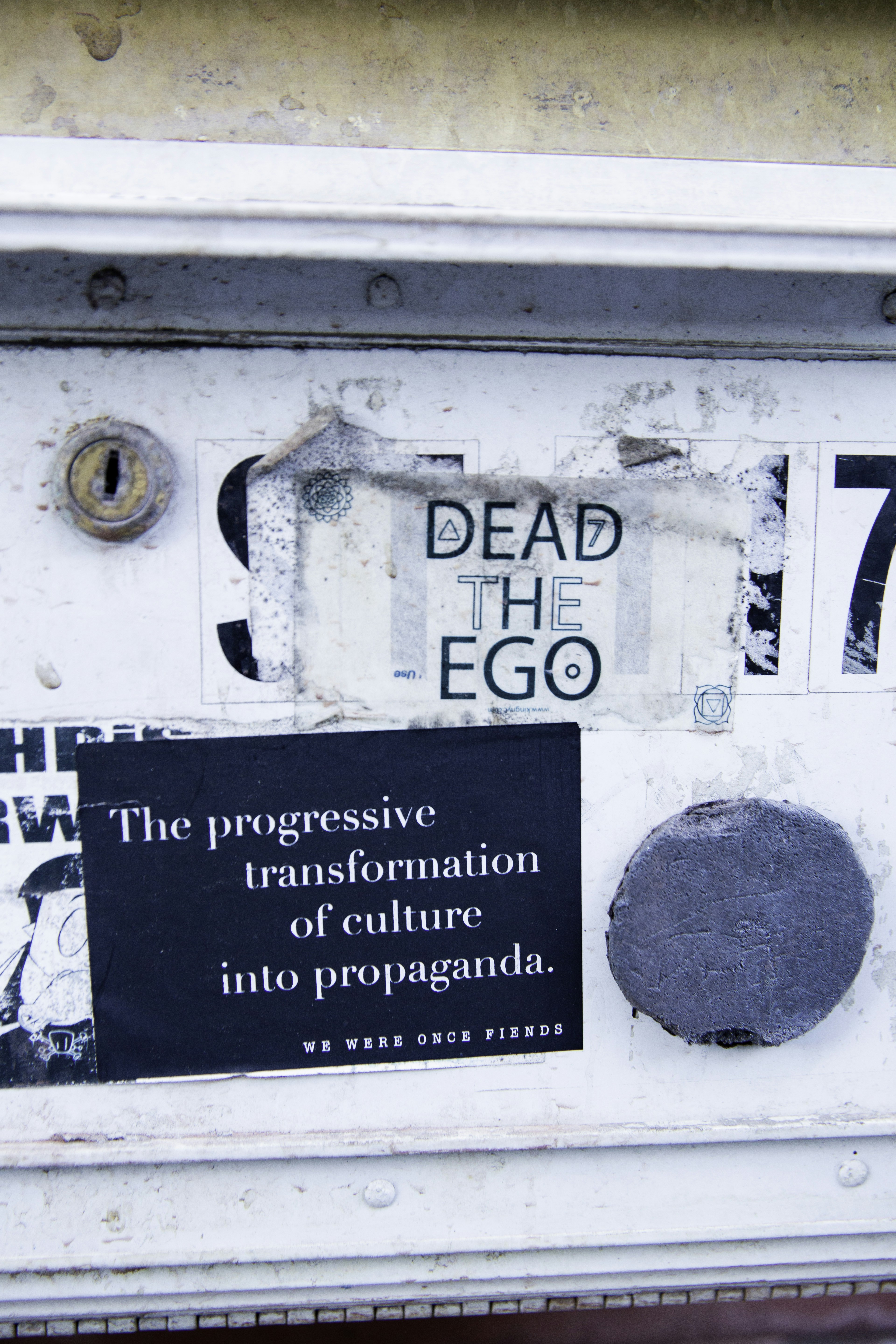 Dead Ends and Street Messages: Stickered Metal Clad in Grey-Blue Urban Light