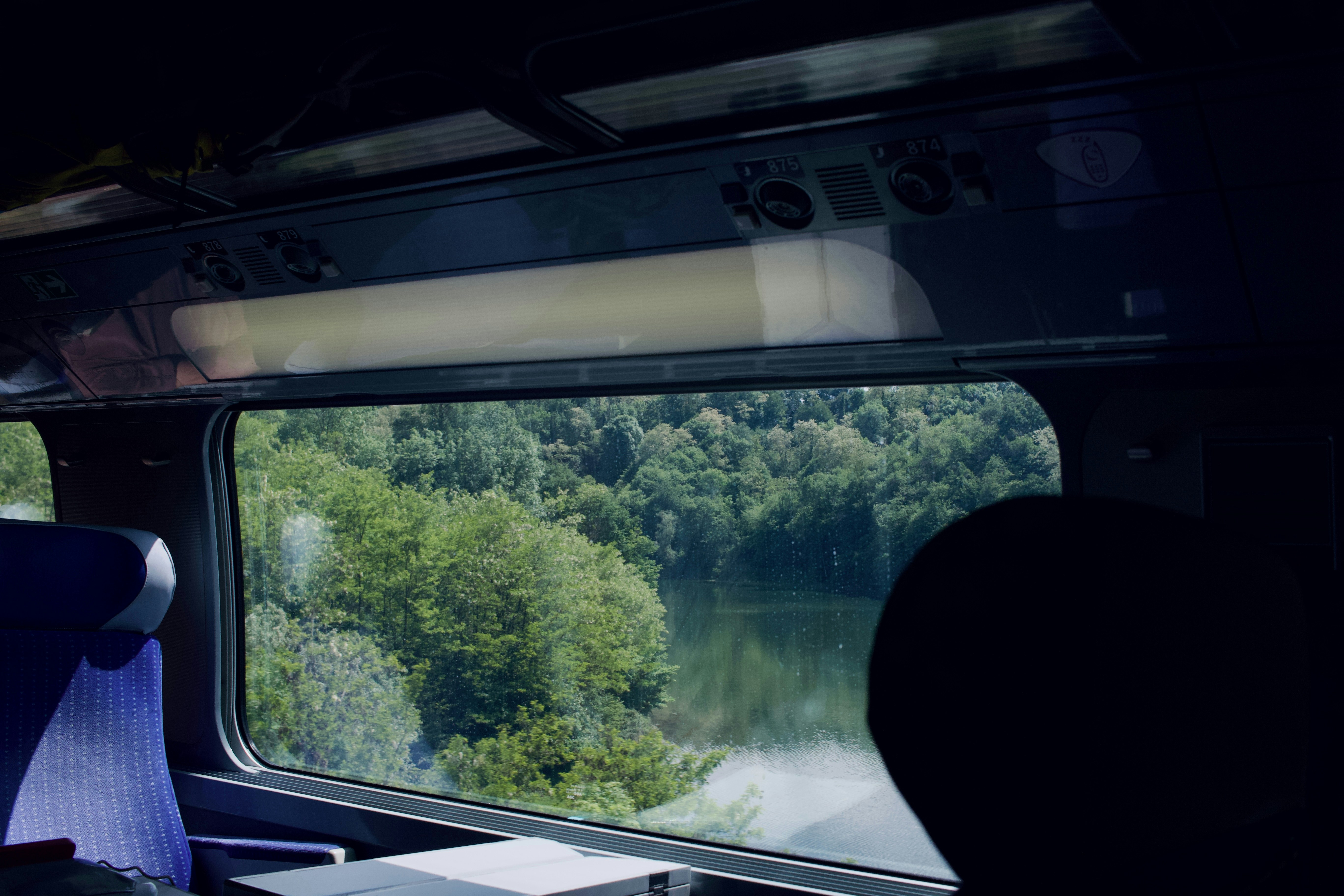 Window to the Quiet River: interior view from a train car looking outward