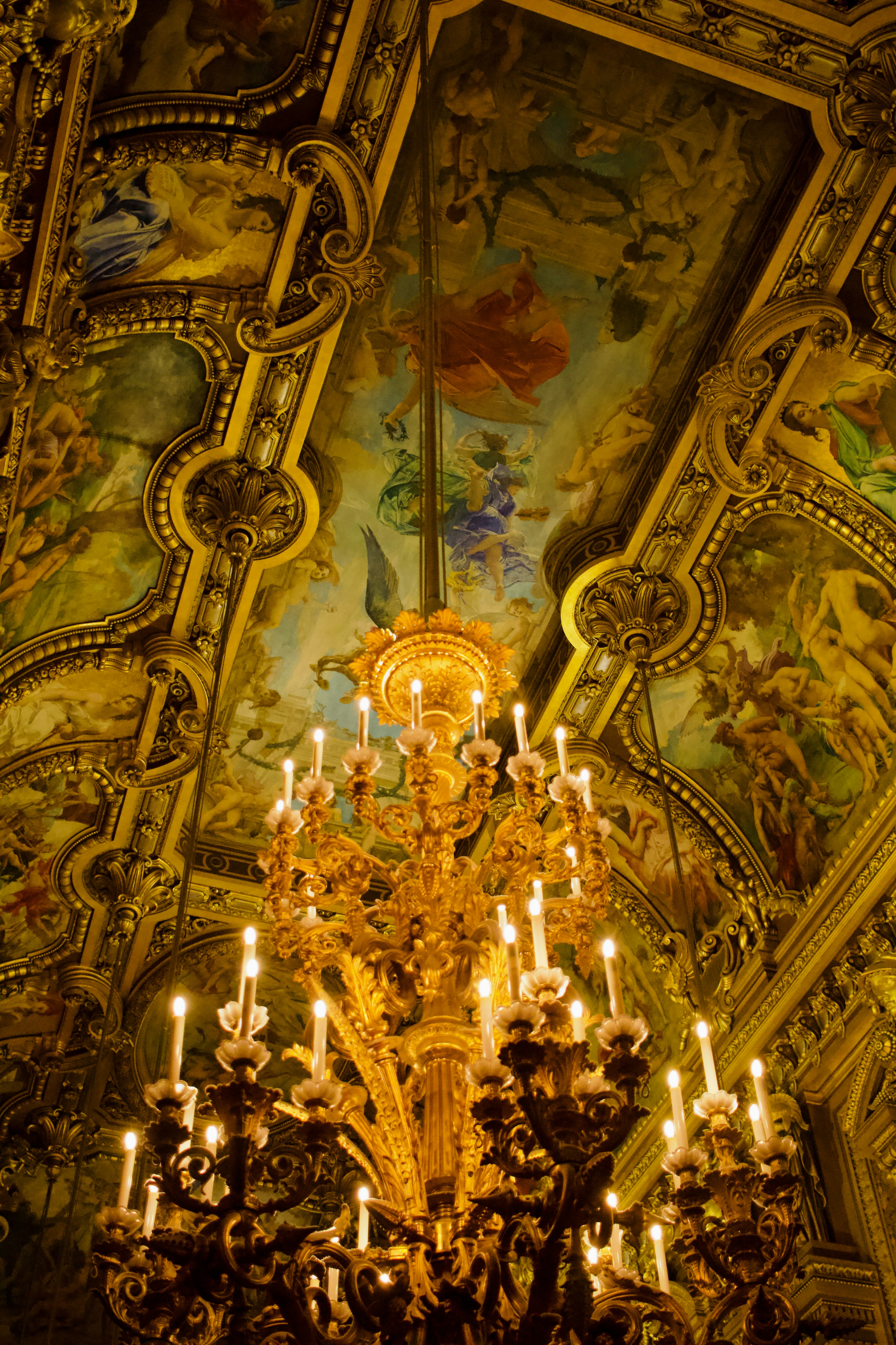 Golden Chandelier Under a Painted Vault