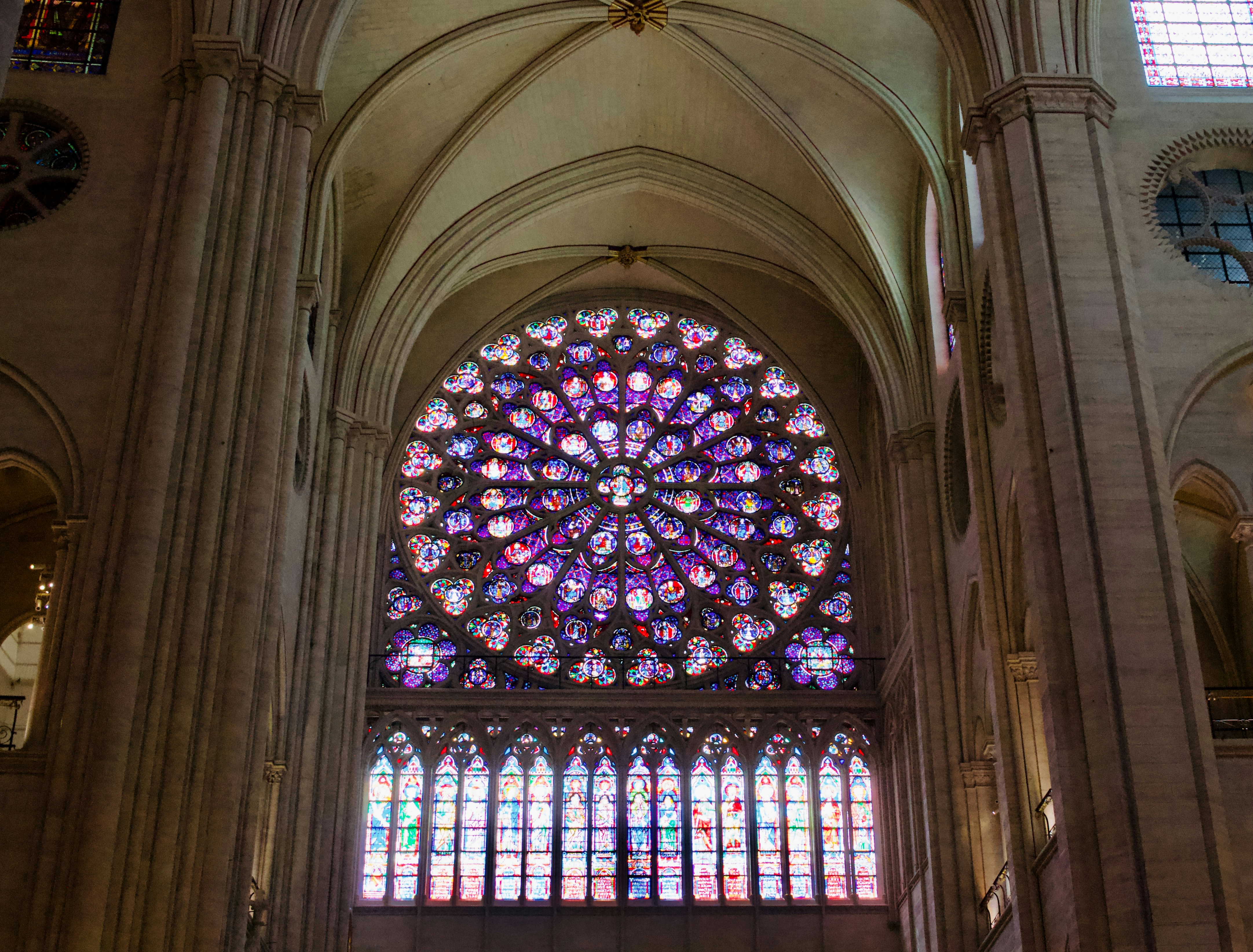 Stained Light: Rose Window Rising Above Arched Nave