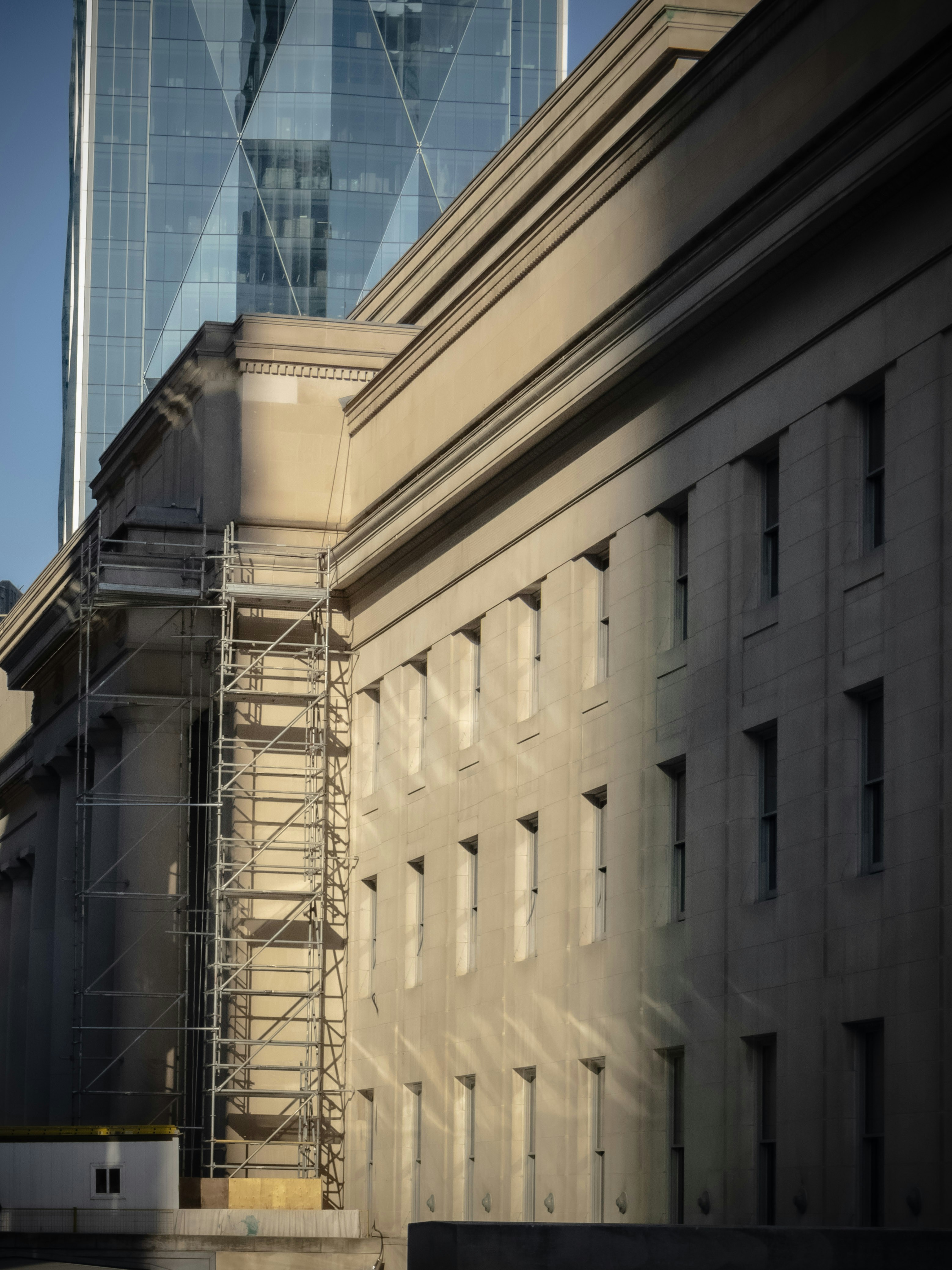 Between Glass and Granite: Urban Facade Under Construction