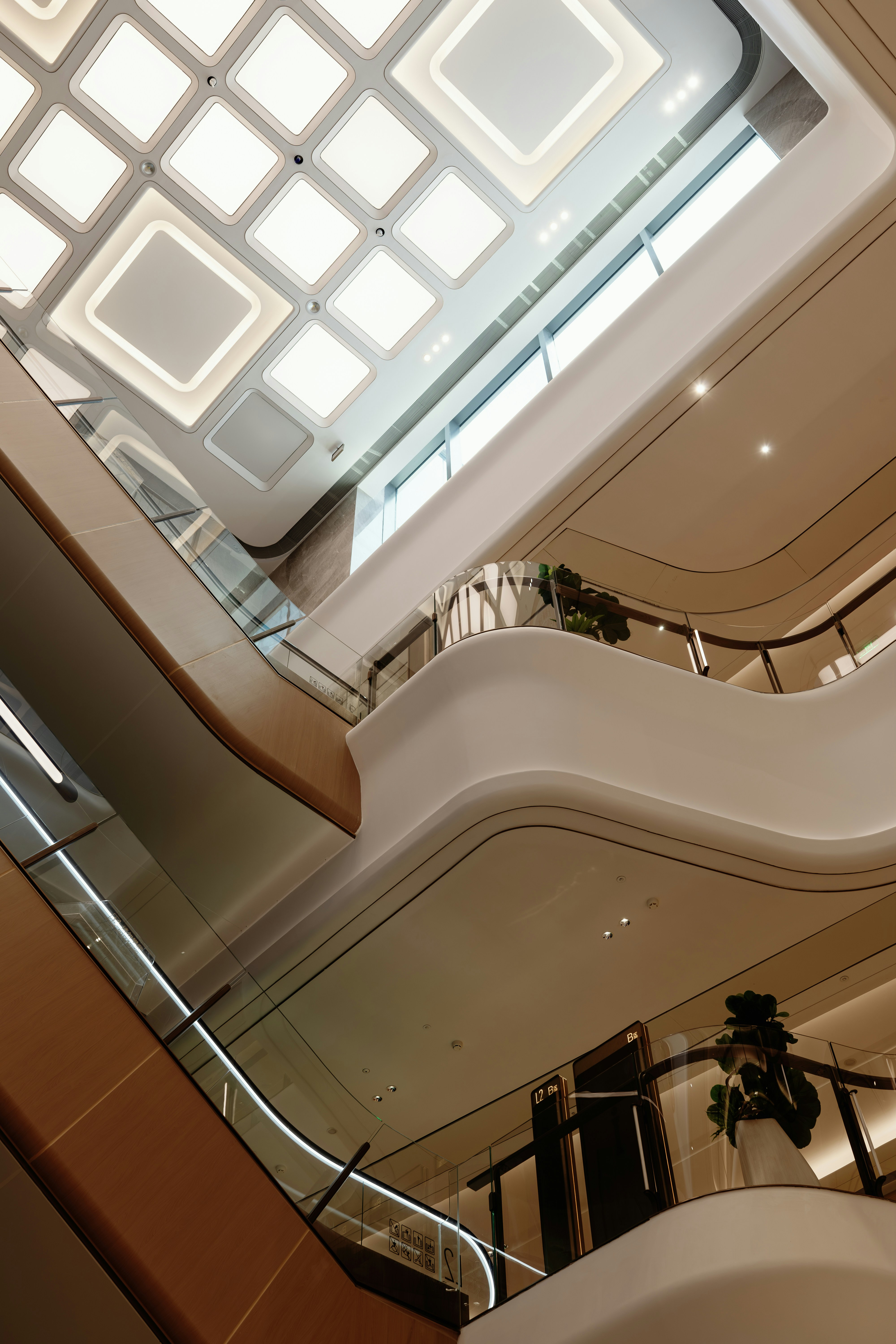 Curved Atrium Elevation: Lighted Squares and Glass Railings