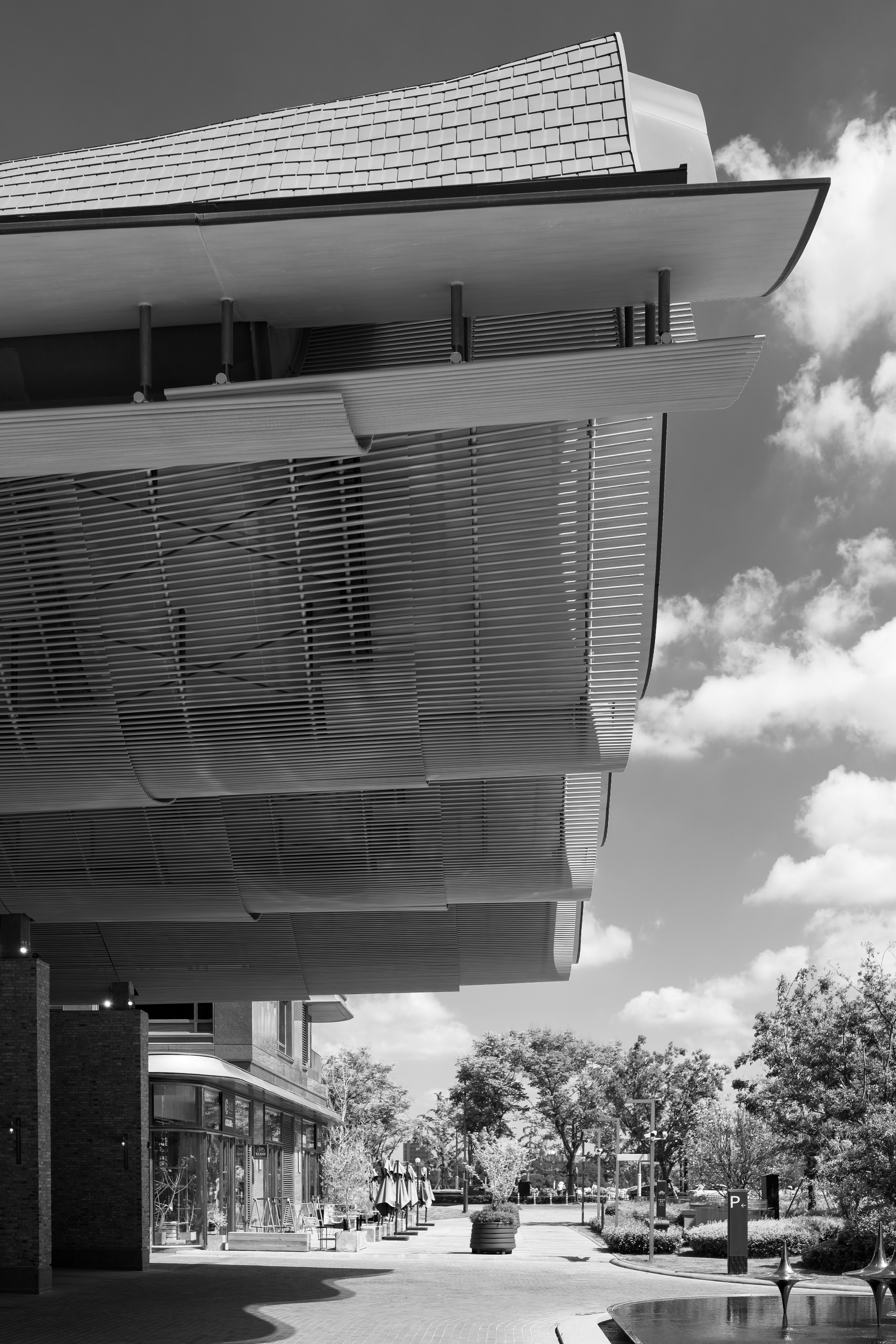Overhang Echoes: Modern Architecture and Shadowed Promenade