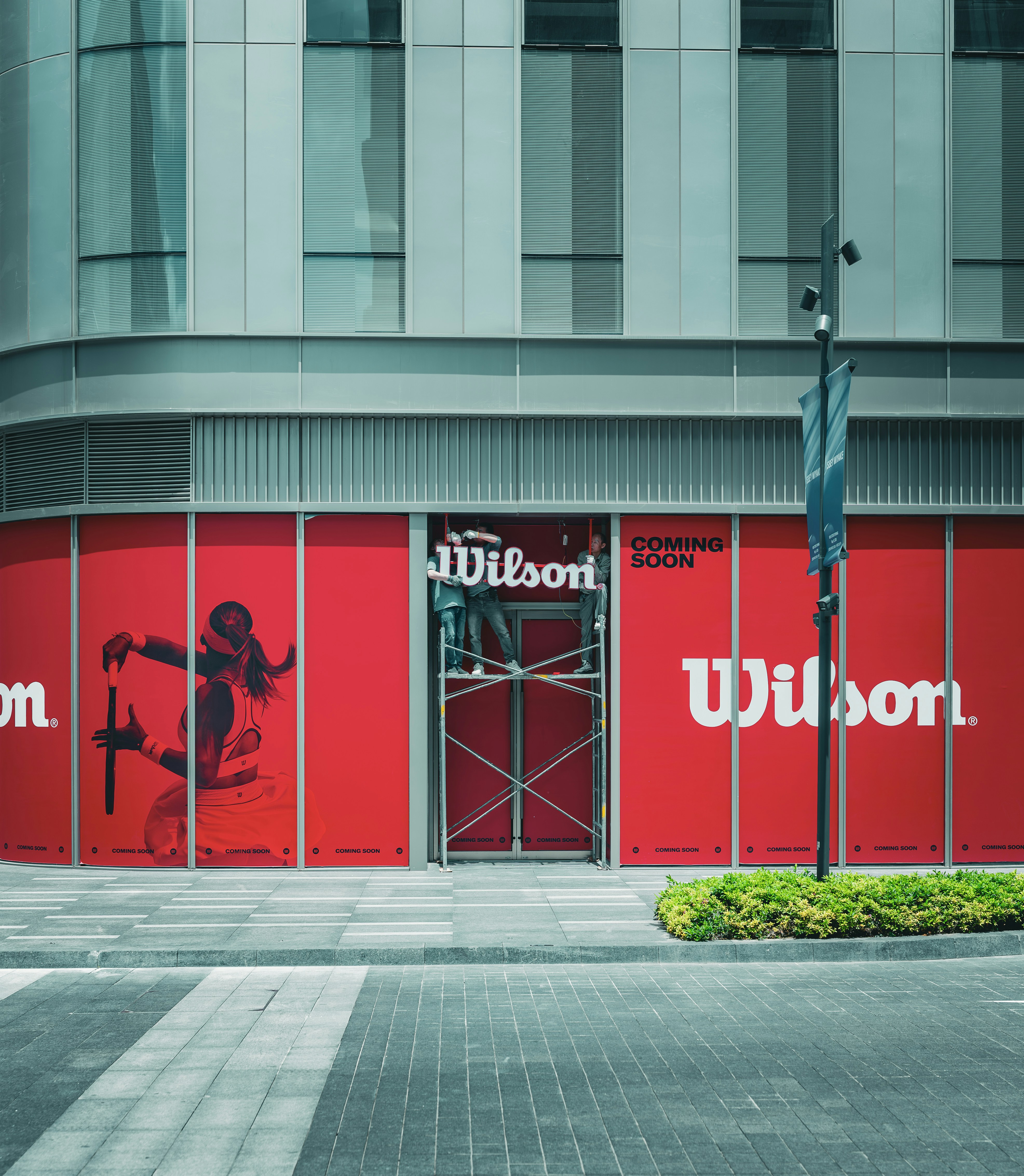 Wilson store under construction with red "coming soon" signage