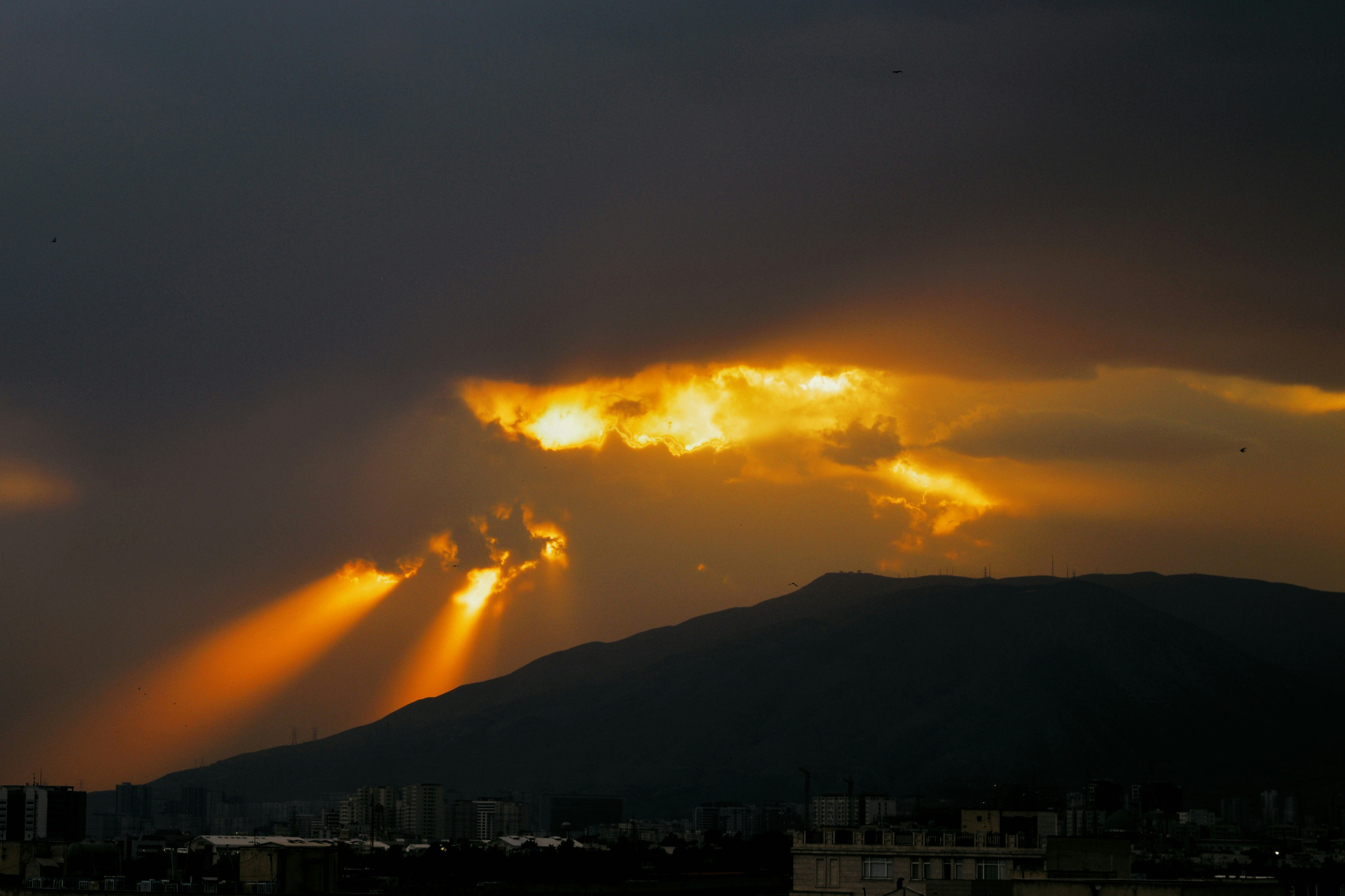 Rays Through a Distant Ridge at Dusk