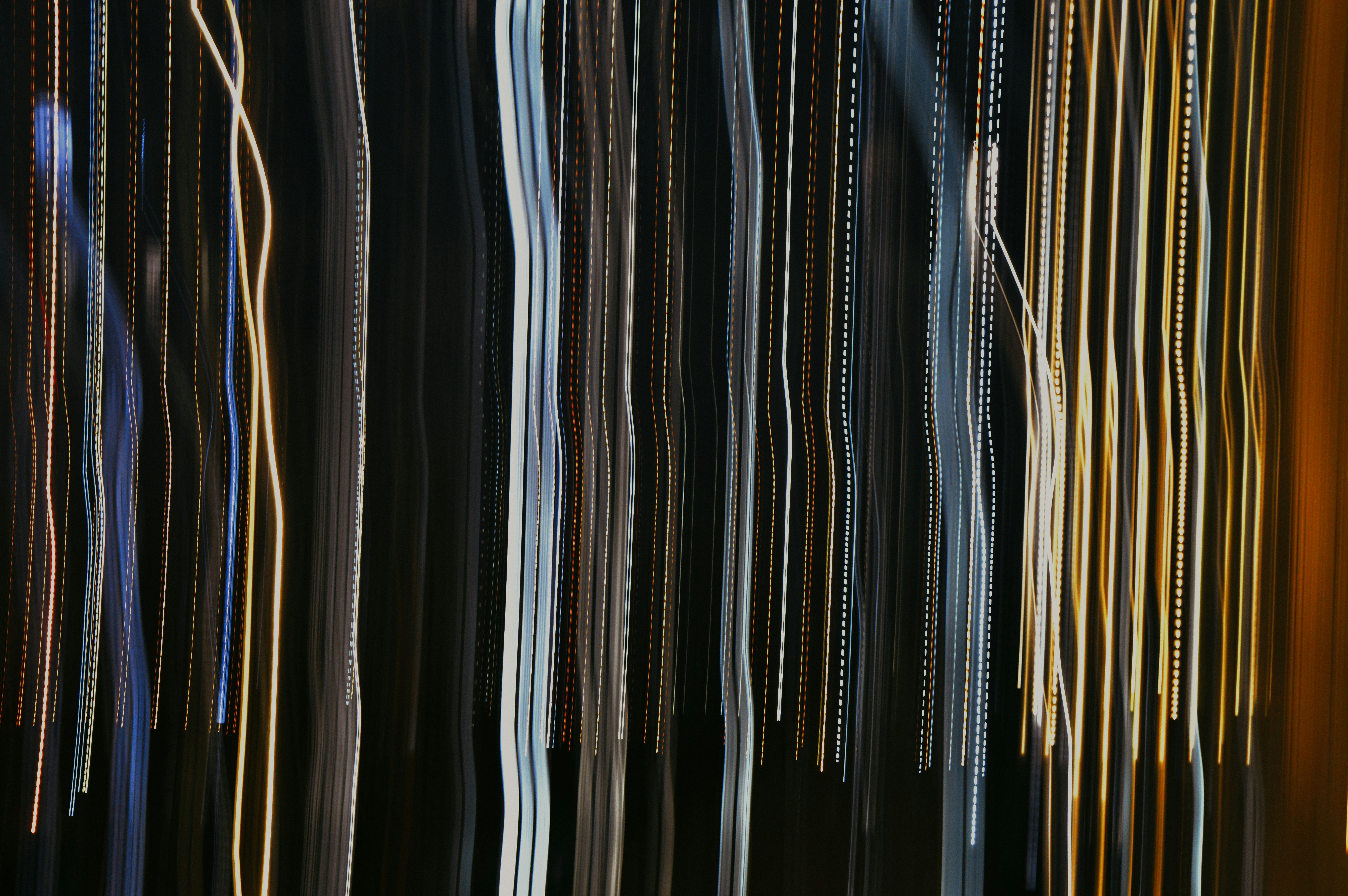 Vertical Light Trails in Motion: An Abstract Nightscape