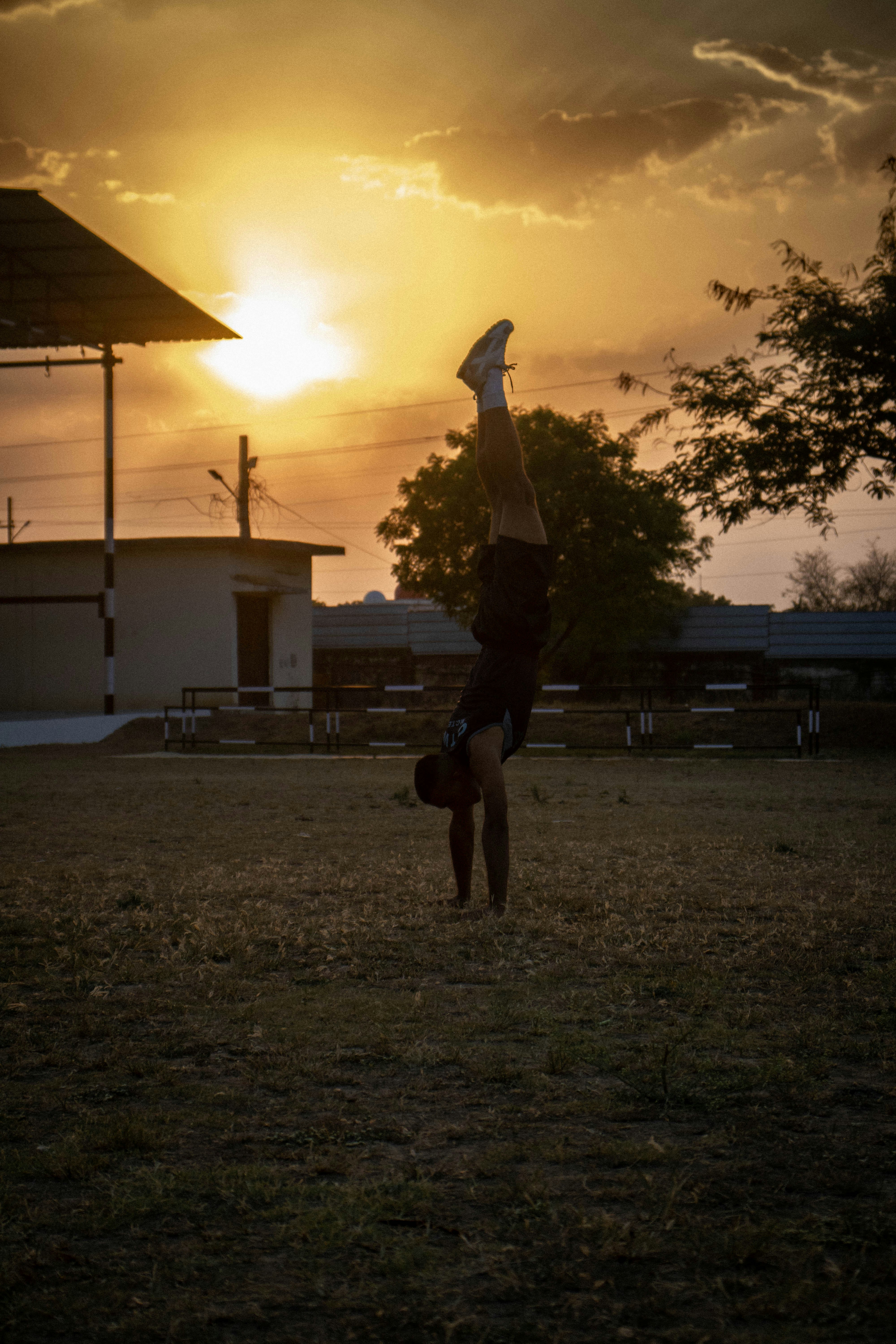 Sunset Handstand: A Silhouette of Focus and Gravity