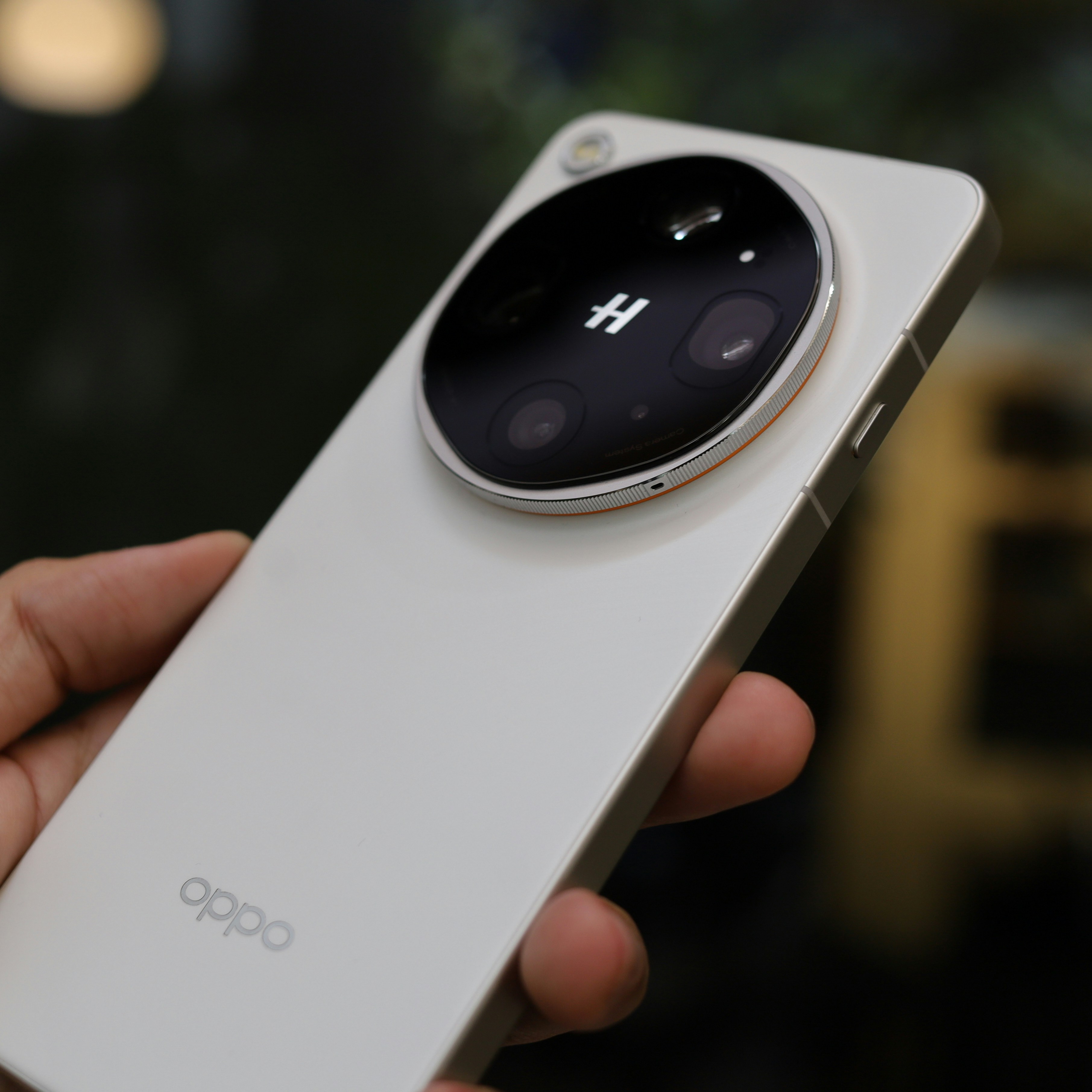 Silent White Oppo: A Handheld Close-Up of the Circular Camera Module