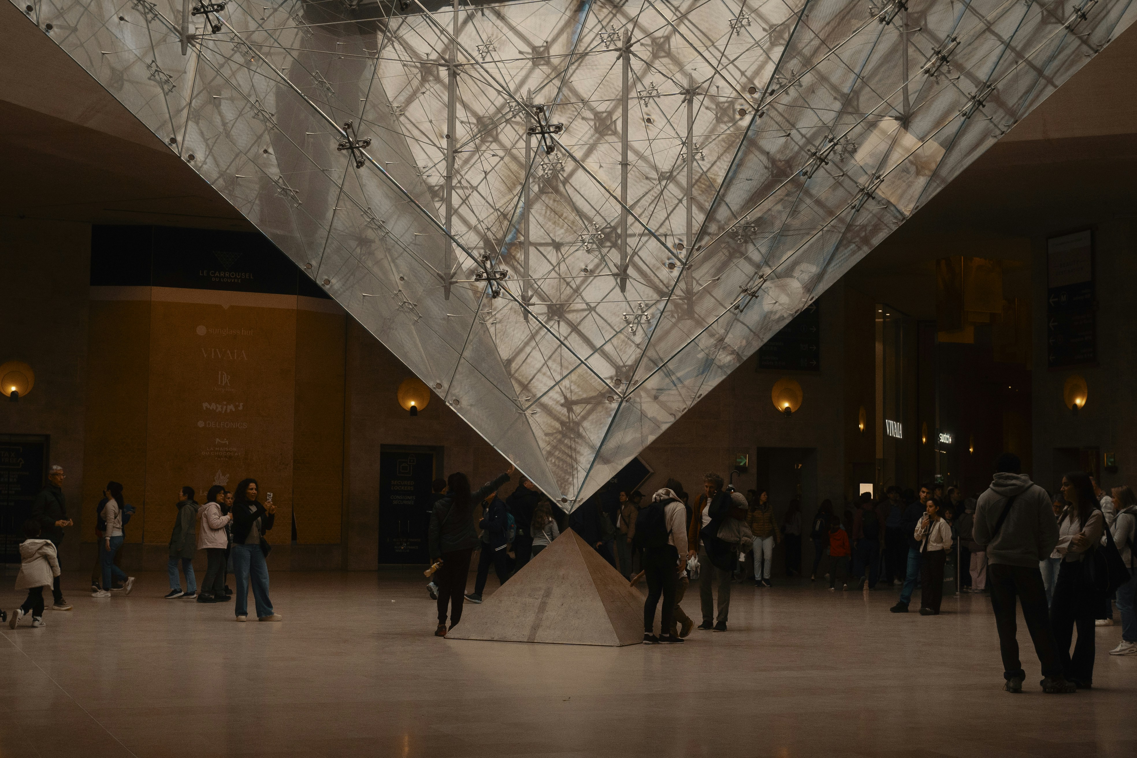 Symmetrical Glass Pyramid Intersection: A Quiet Moment under the Louvre