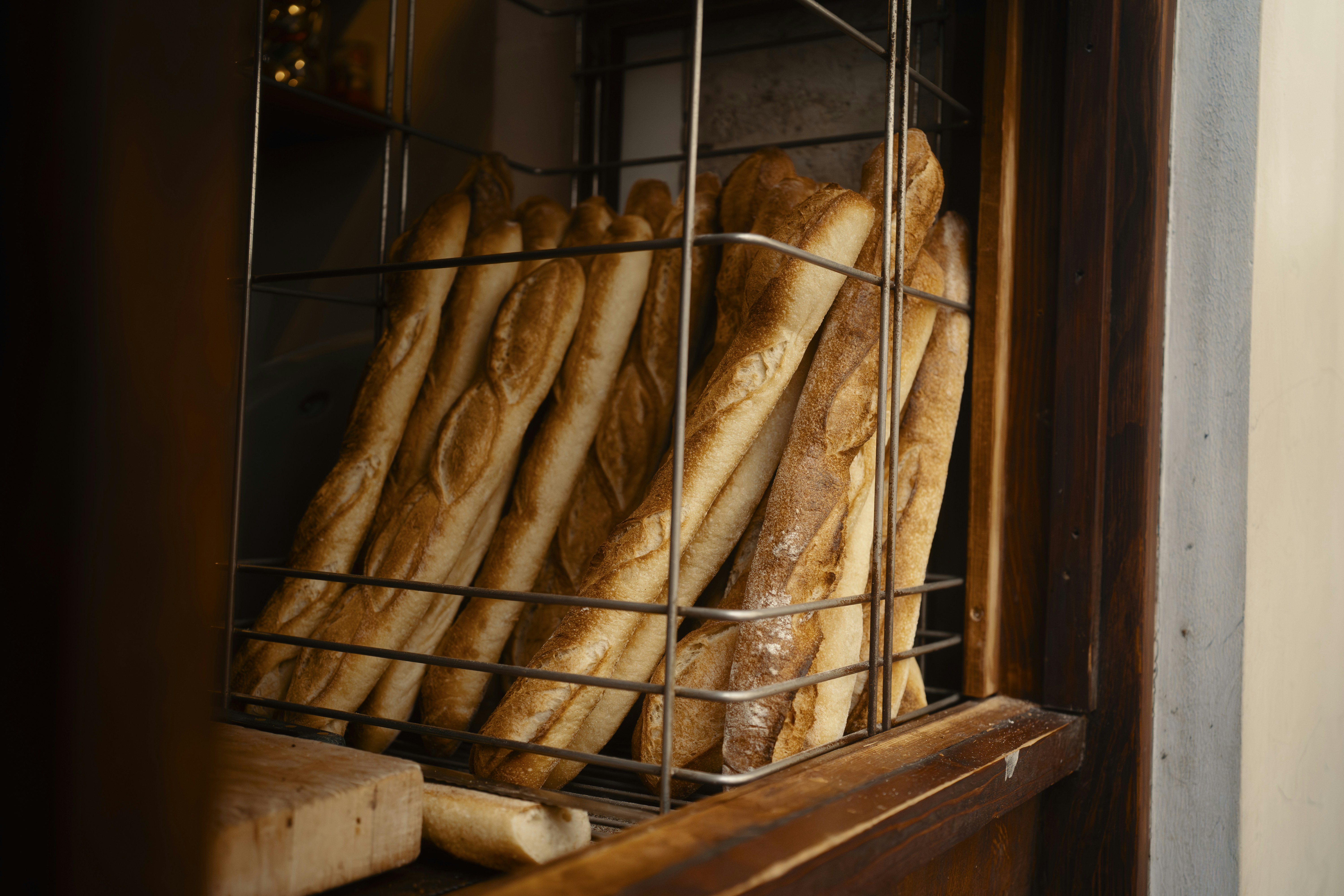 Golden Baguettes Warm in a Bakery Display