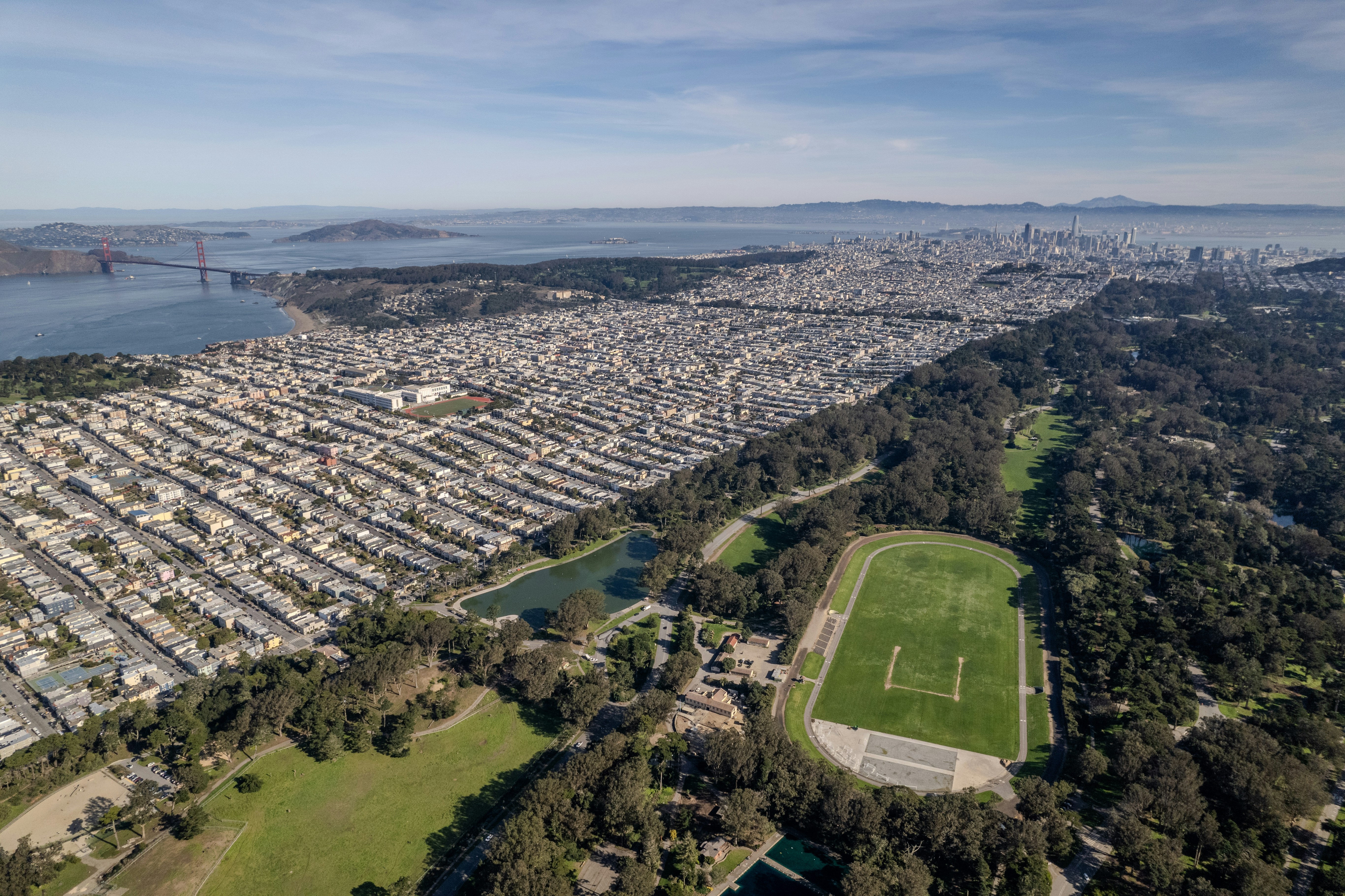 Aerial View Over Bay Area: Community Grid, Park, and Shoreline