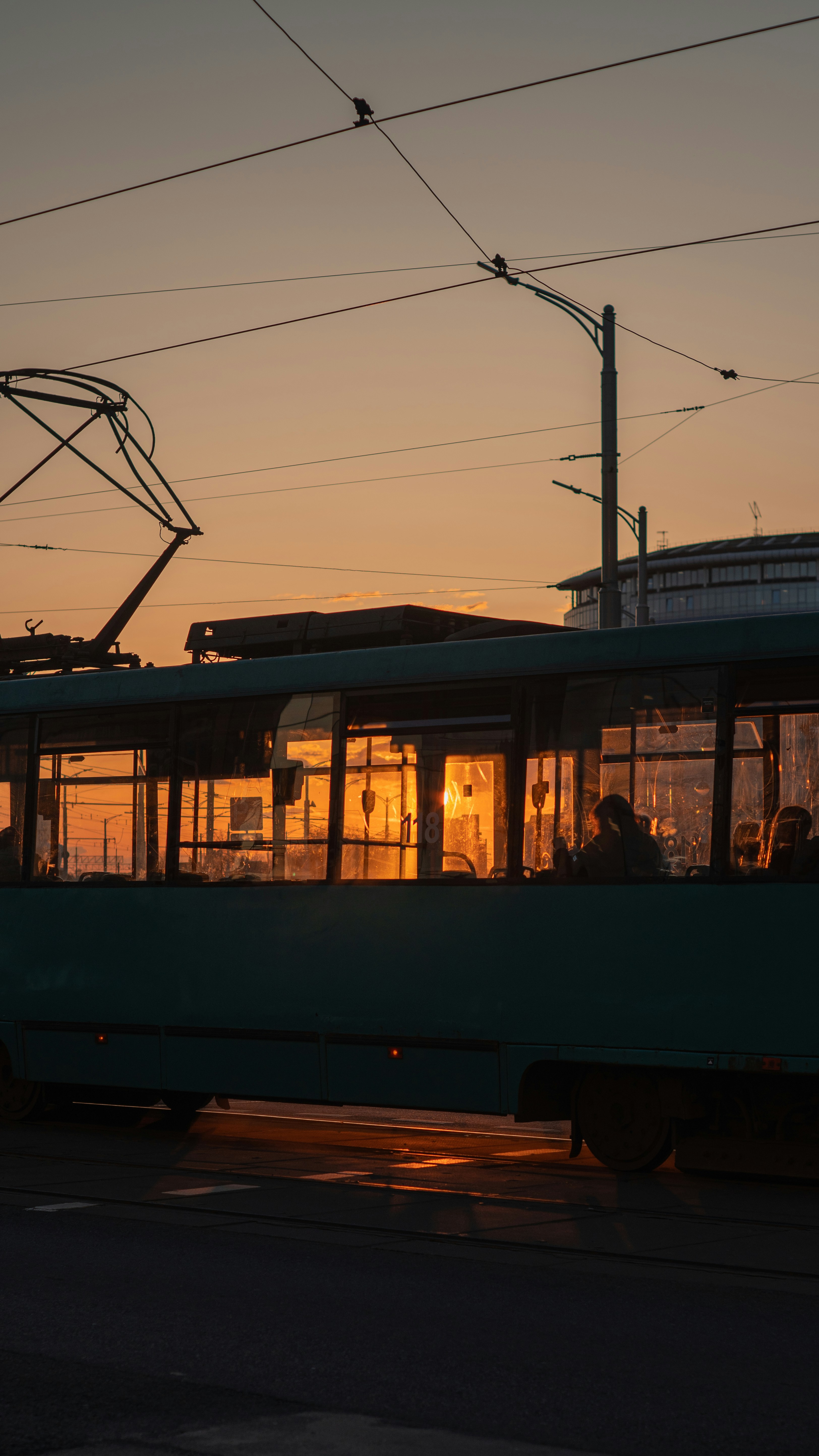 Sunlit Tramscape: A Glowing Evening Through Glass