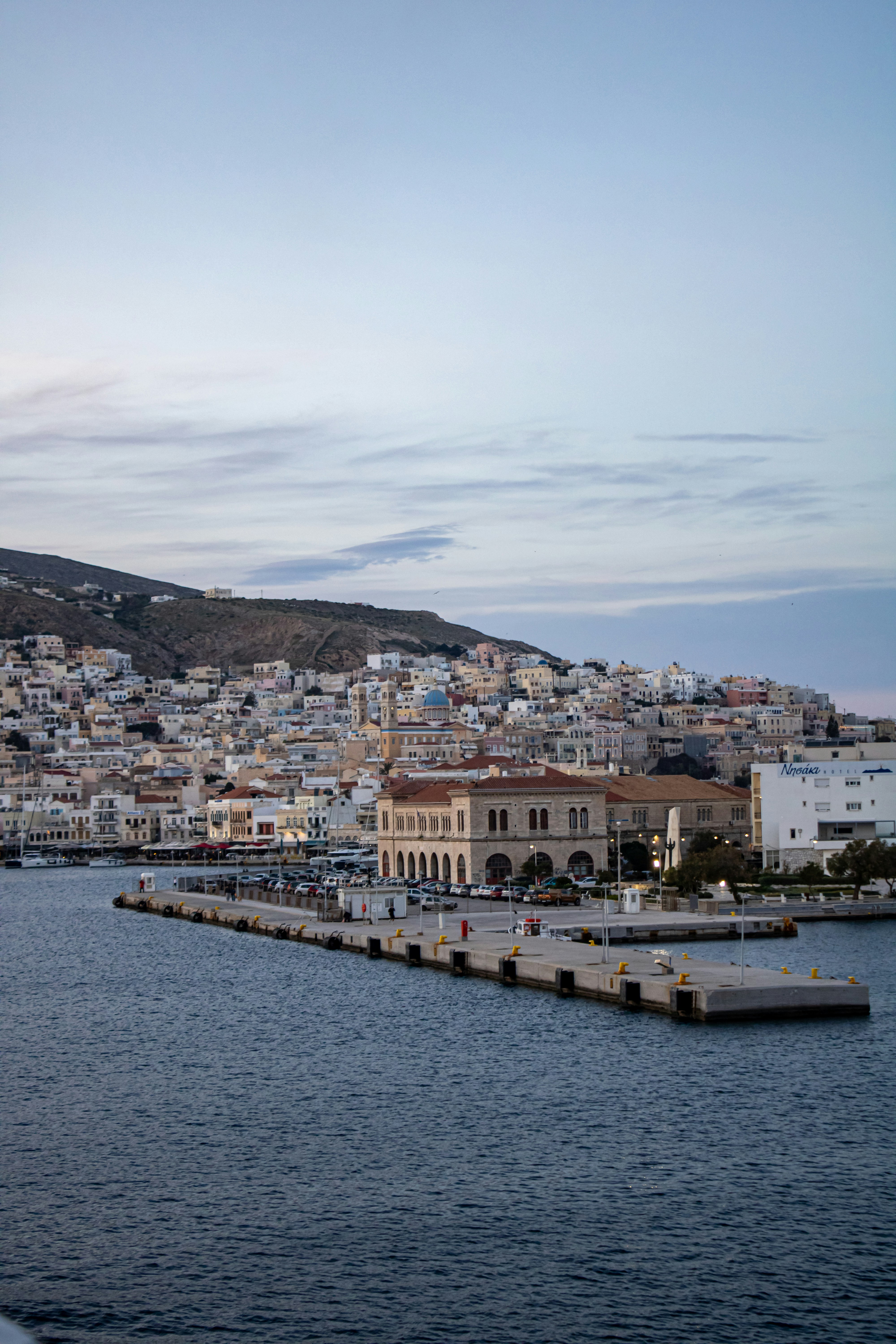 Harborfront Mosaic: A Mediterranean Town Embraced by Indigo Waters