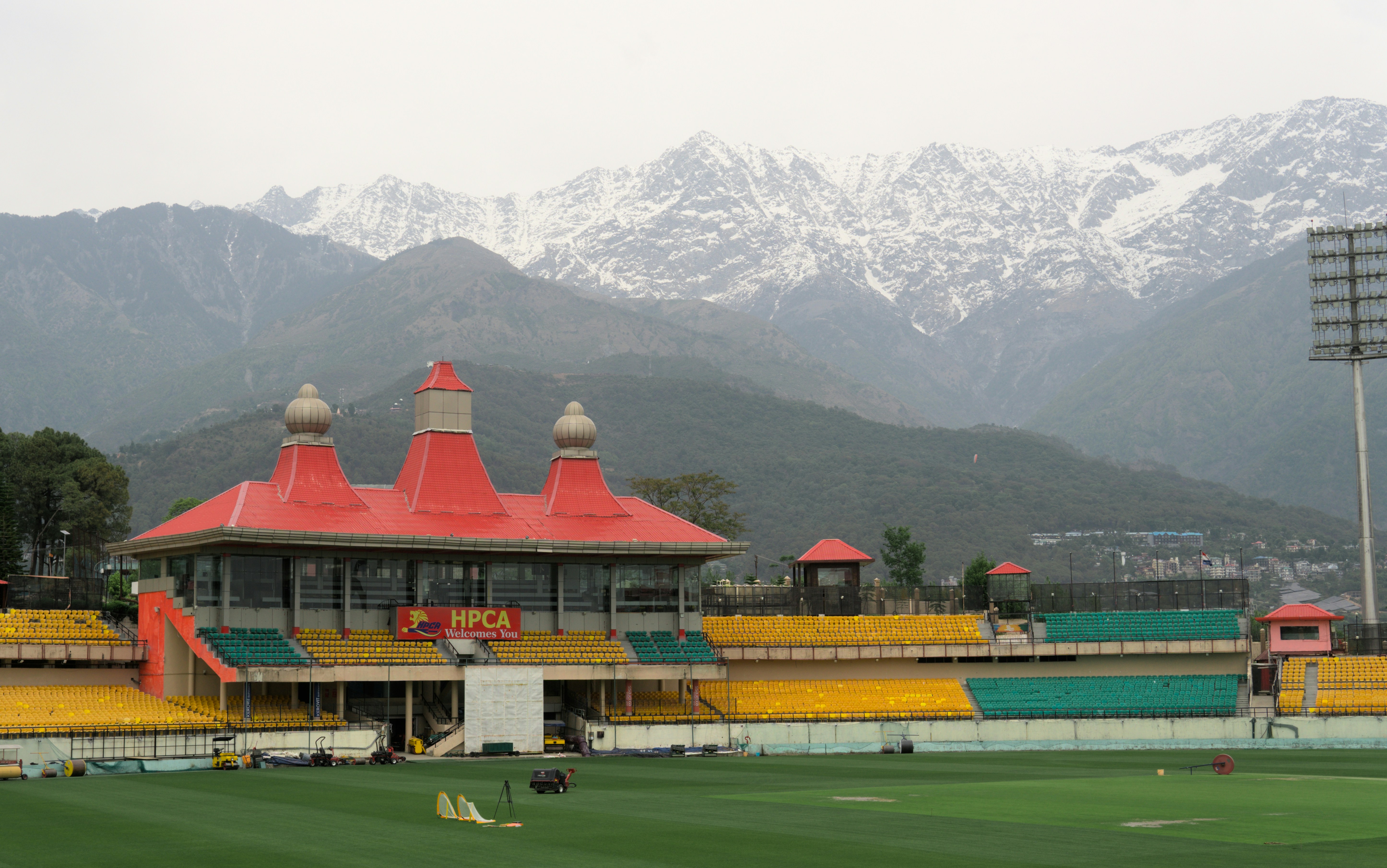 Red-roofed Pavilion at the Edge of a Mountain Stadium