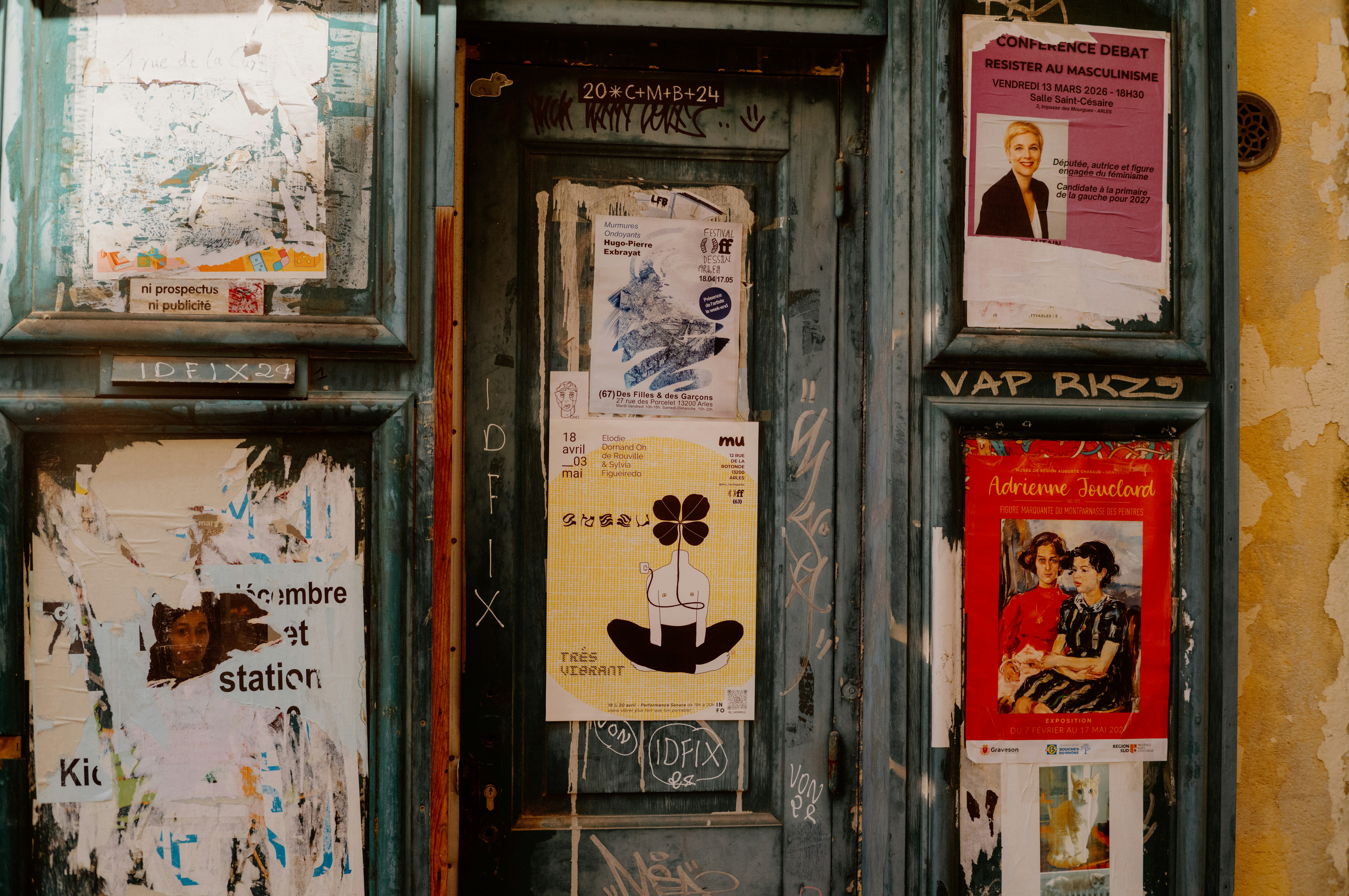 Weathered doorway posters: fragments of urban memory
