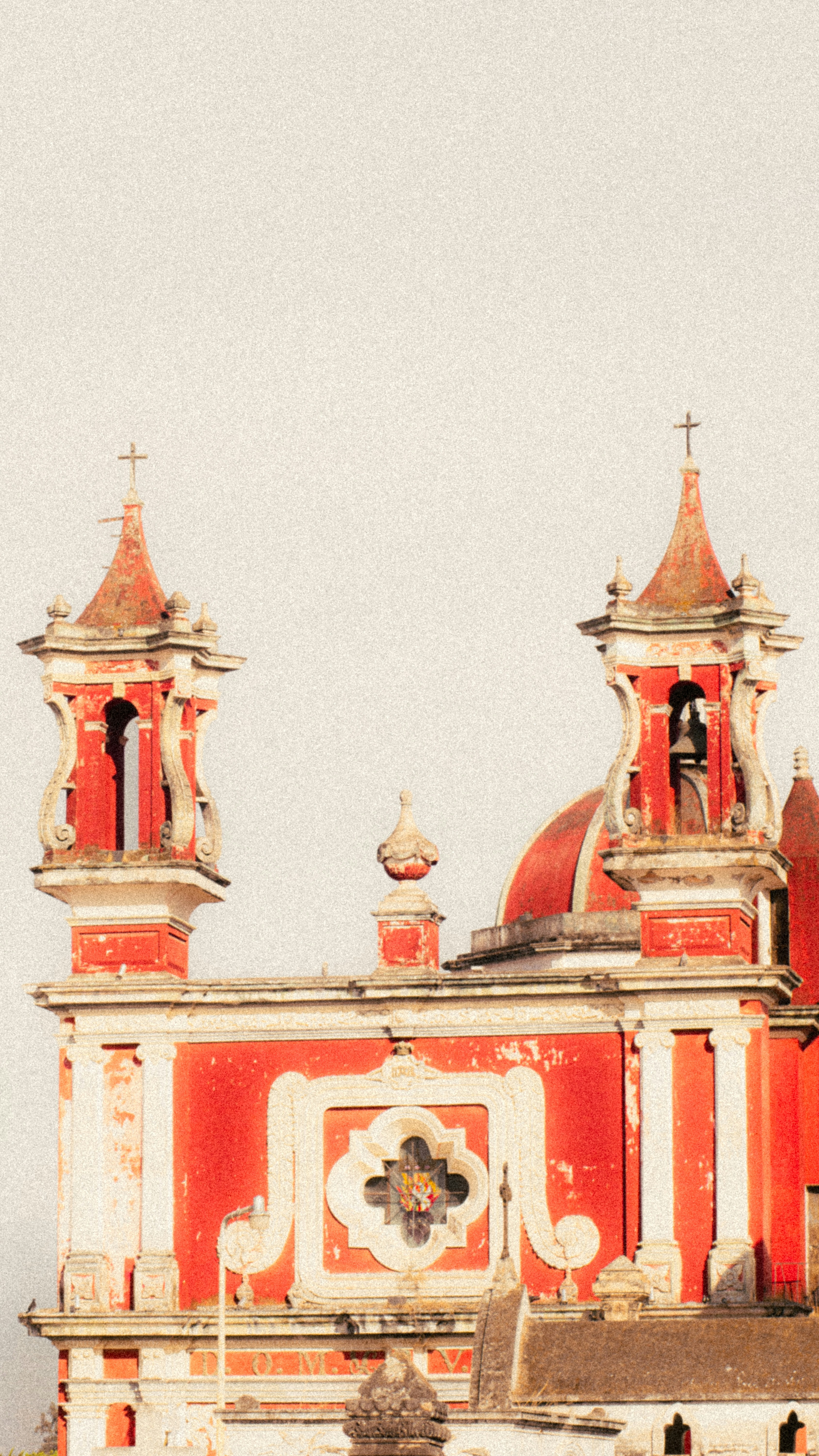 Red Baroque Facade Reaching Toward the Sky
