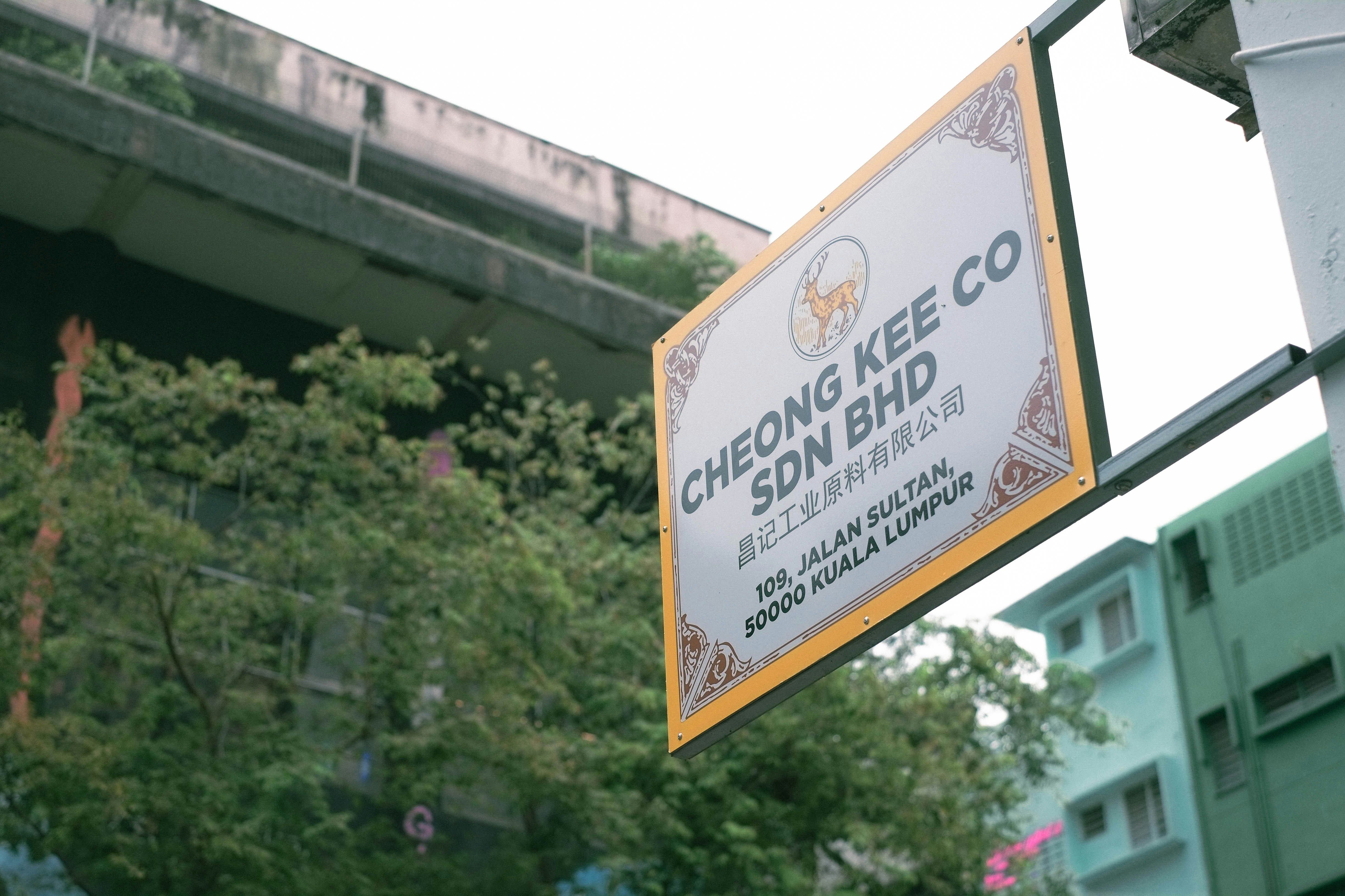 Signboard over a quiet street in Kuala Lumpur