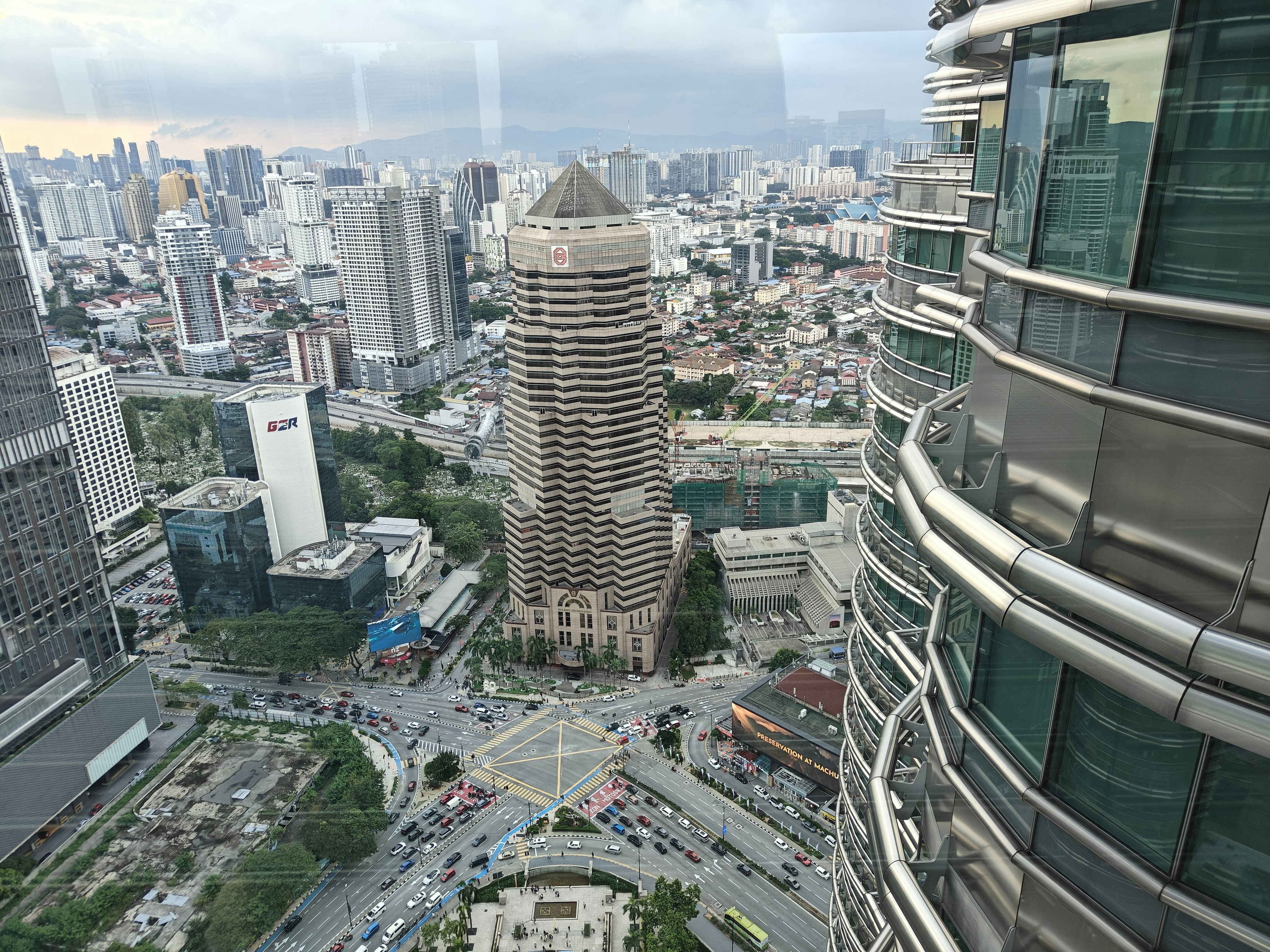 City Mosaic: Aerial Intersection Beneath Glass and Sky