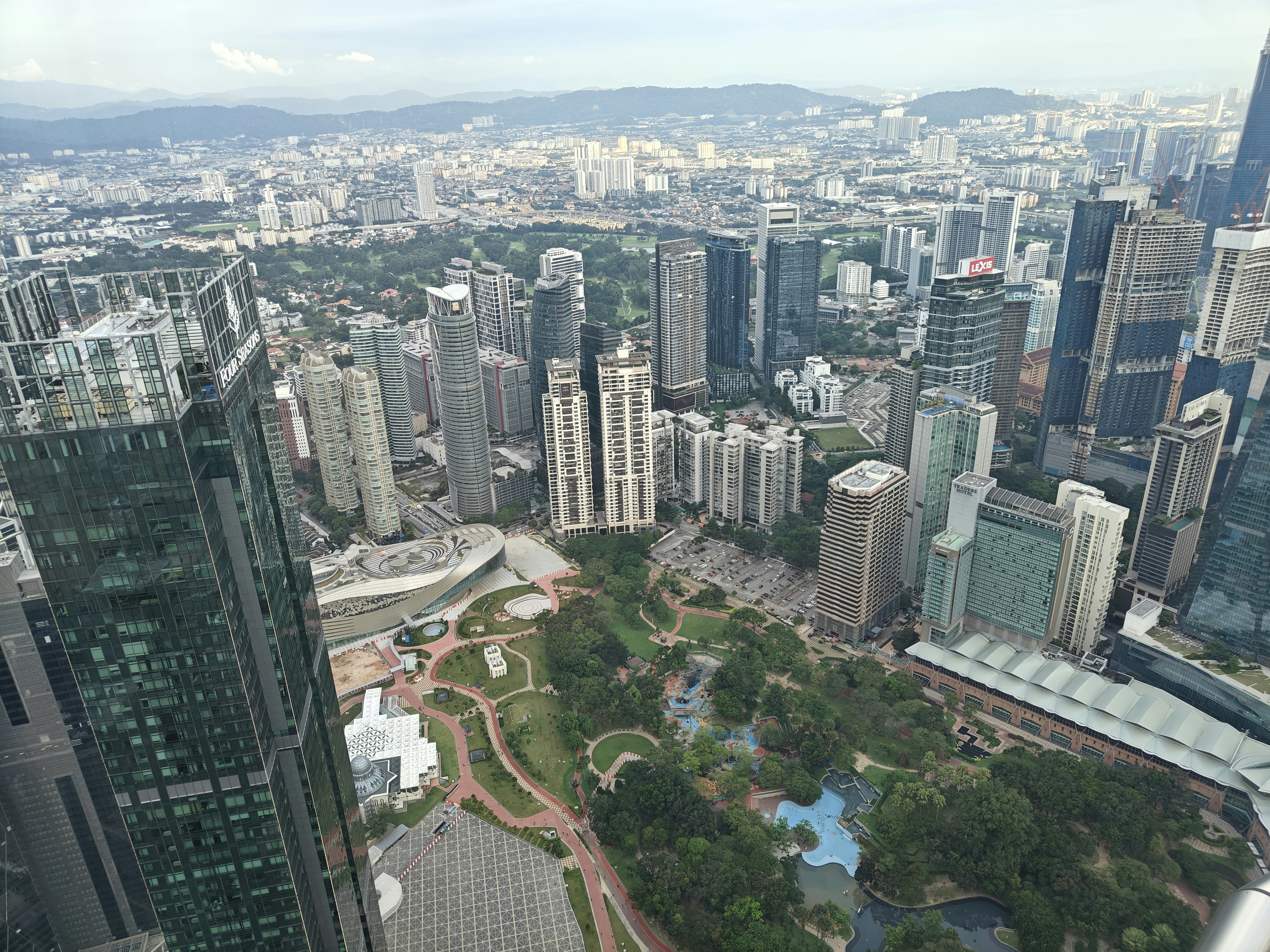 Aerial Olive Park Overlook: City Spine Surrounded by Skyline