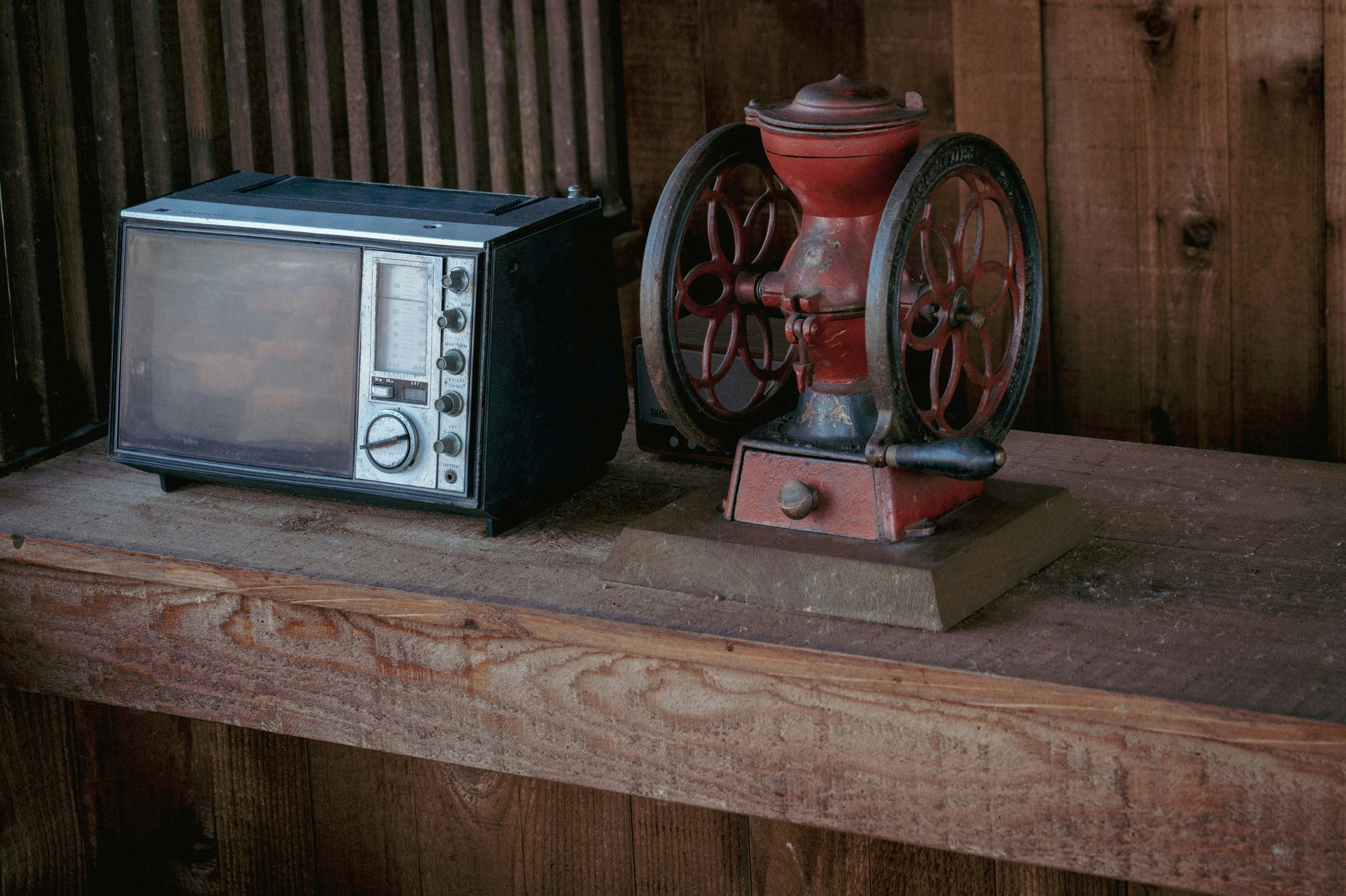 Quiet Nostalgia: A Vintage Microwave and Grinder on a Weathered Shelf