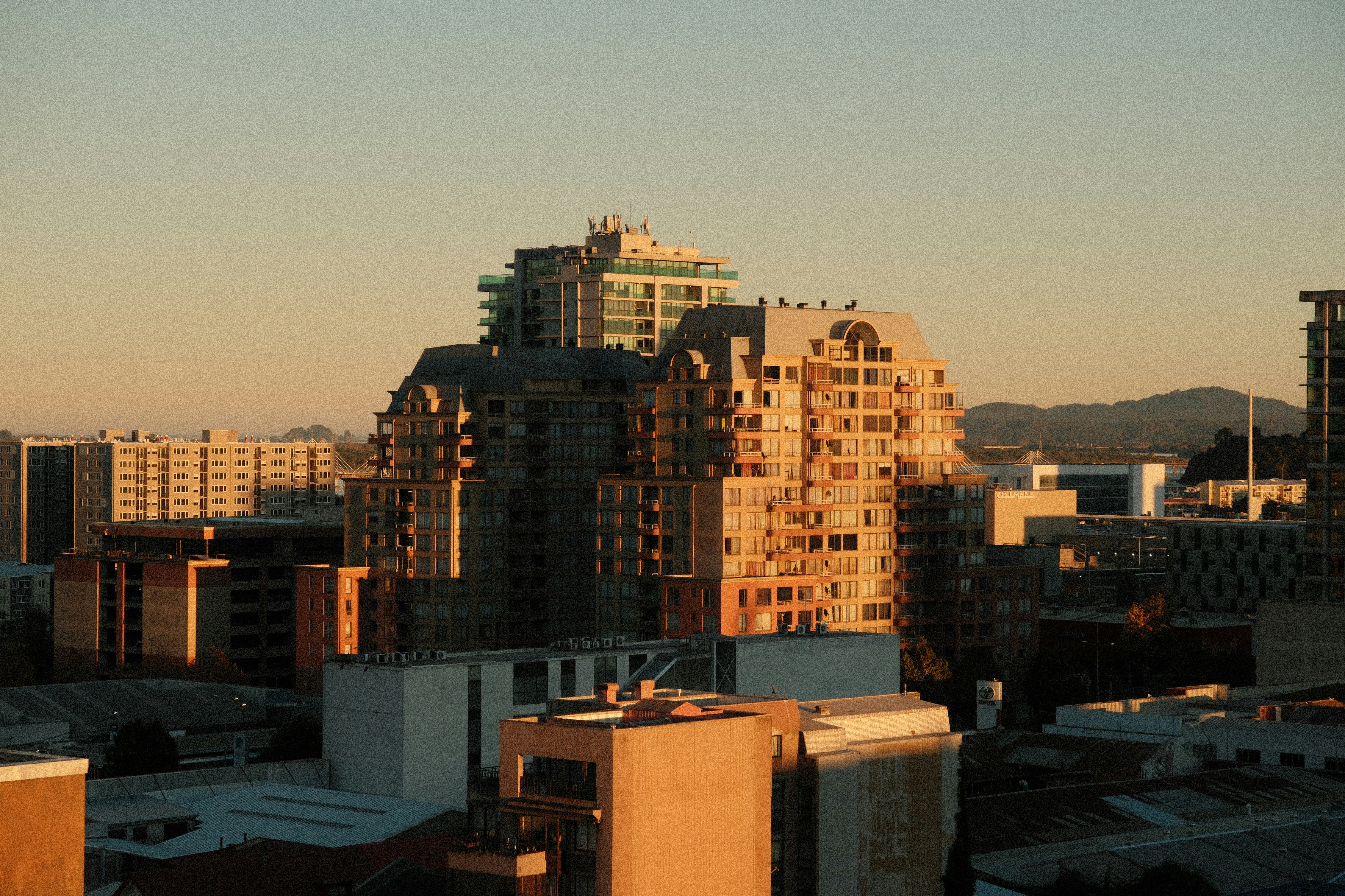 Sunlit Skyline: The Corner Tower Pierces the Golden Hour