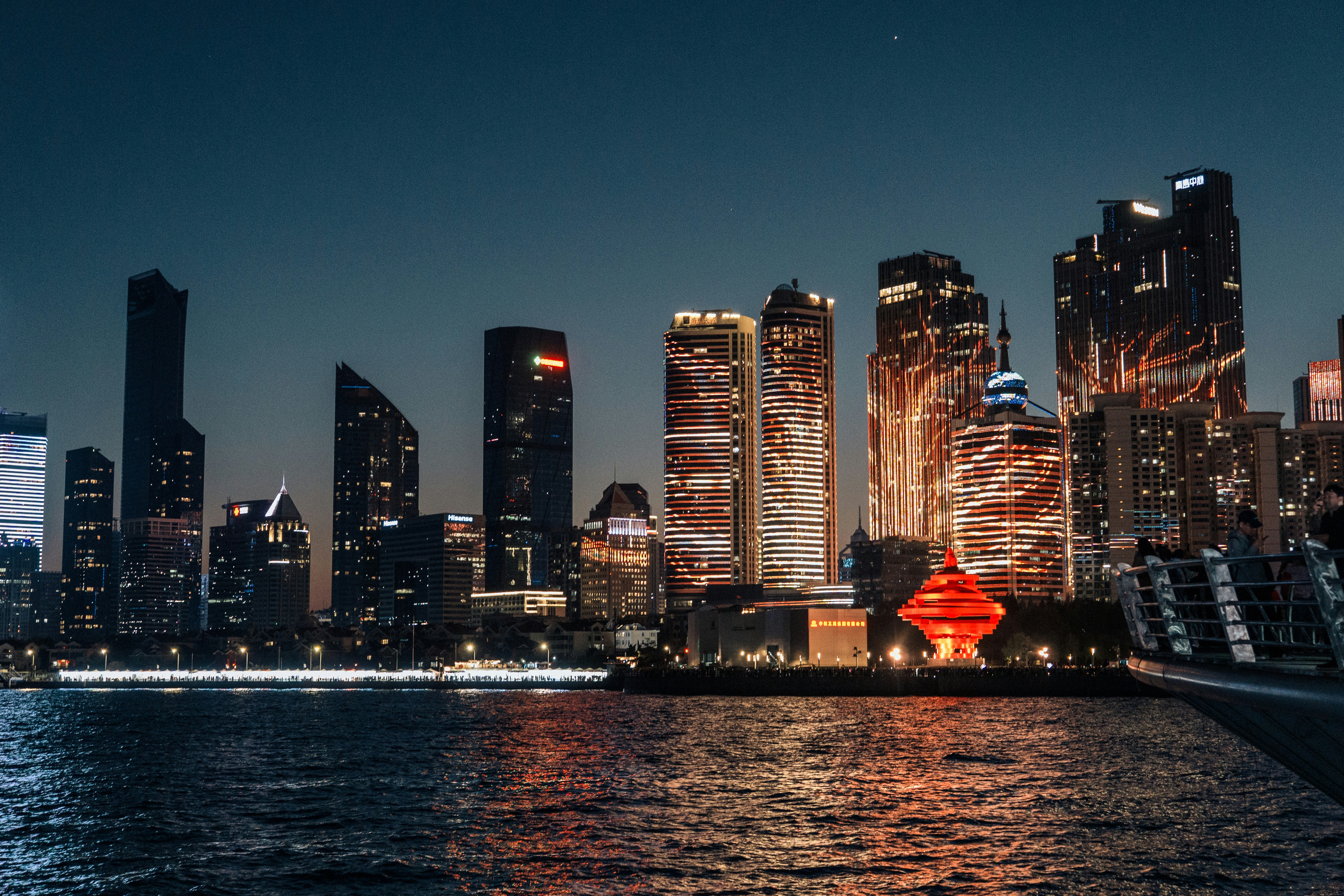 Midnight Harbor: Neon Skyline Over Calm Waters